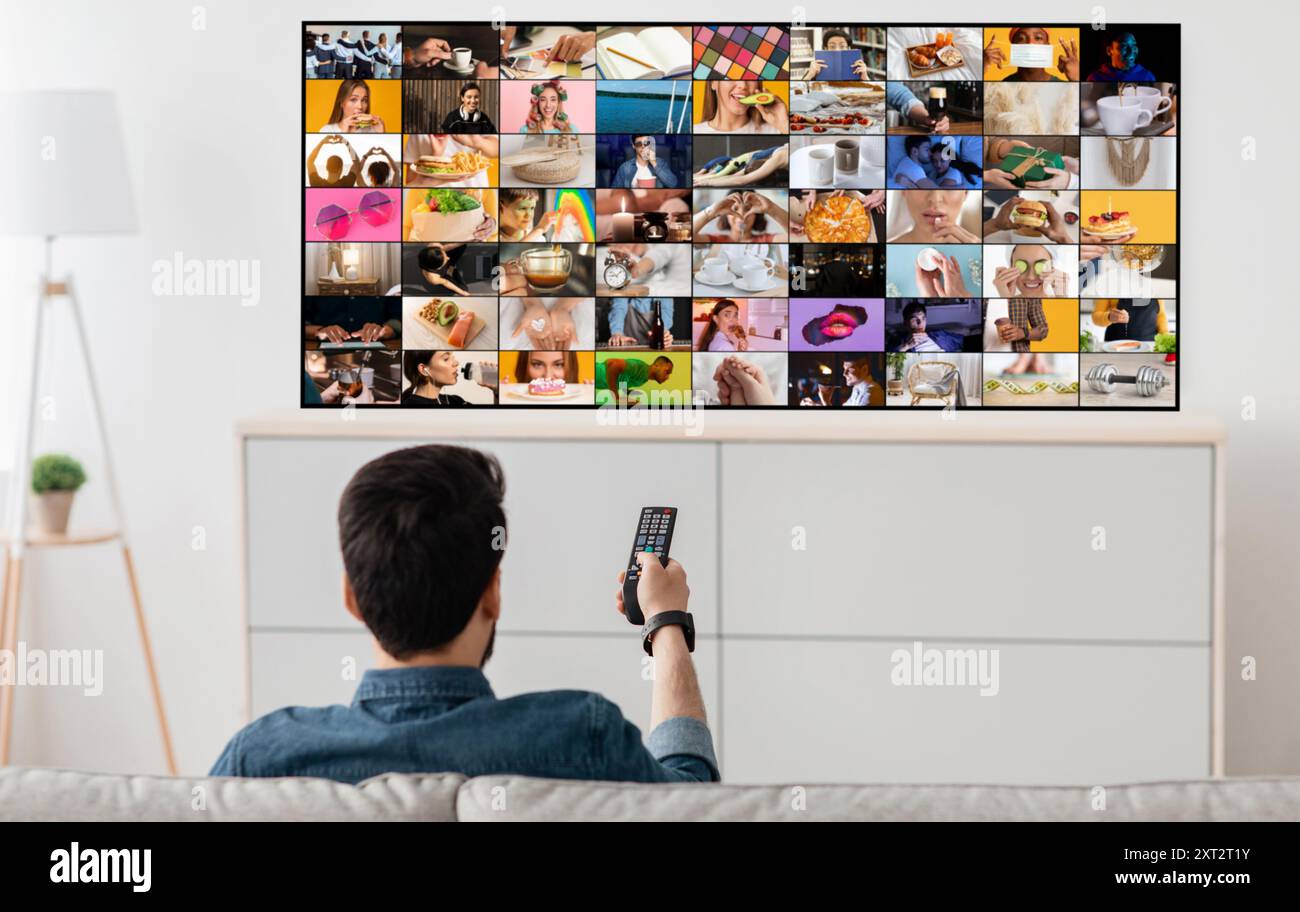 Man Watching Television With Many Channels Displayed Stock Photo - Alamy