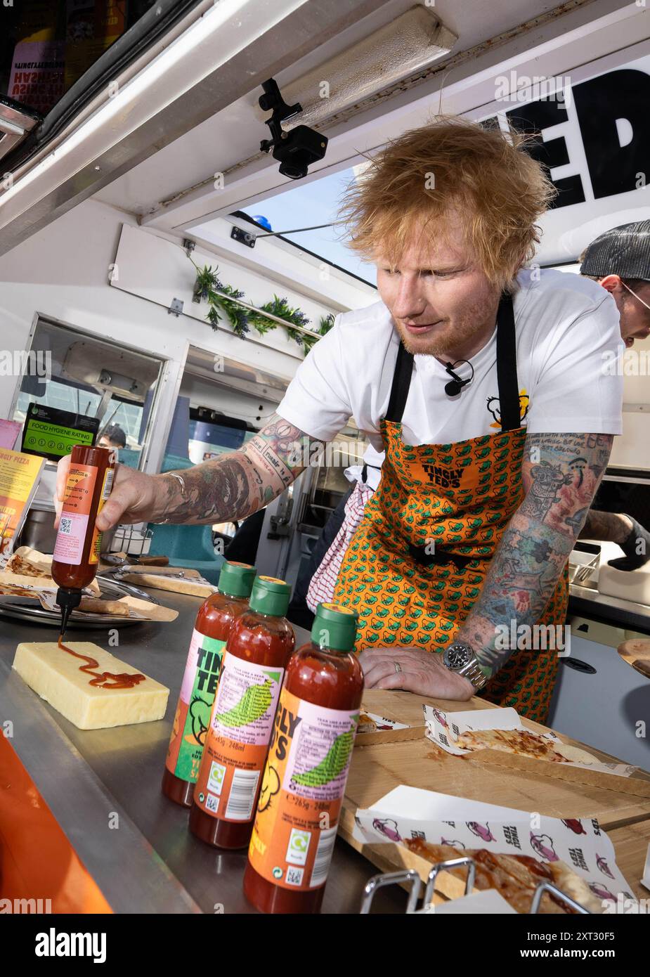 EDITORIAL USE ONLY Ed Sheeran surprises Sainsbury's supermarket ...