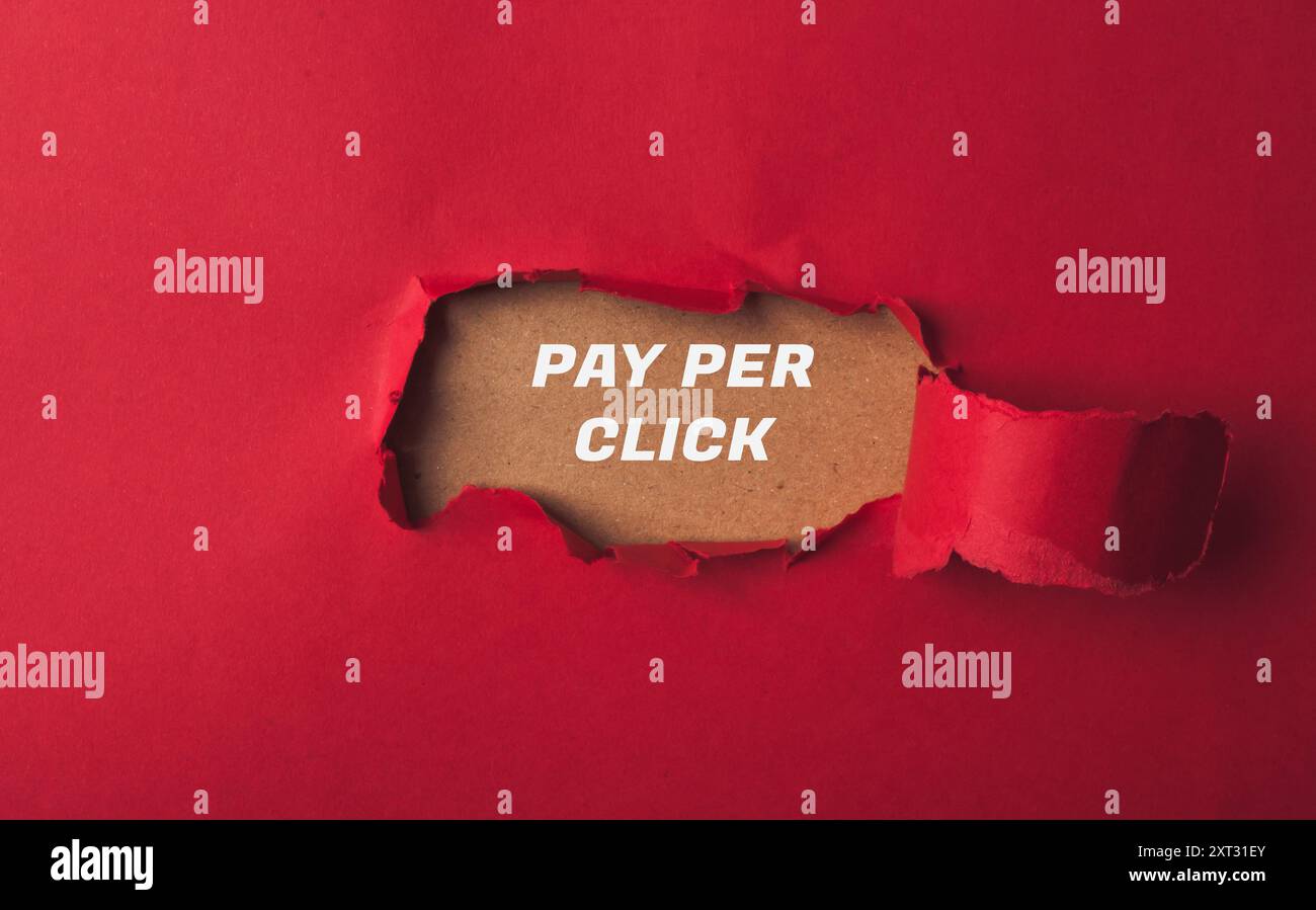 A red background with a hole in it and the words pay per click written ...
