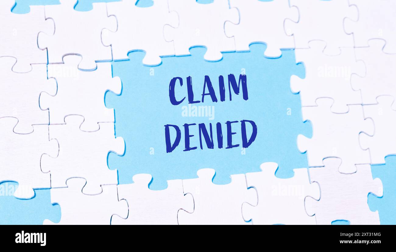 A jigsaw puzzle with the word claim written in blue letters. The puzzle ...