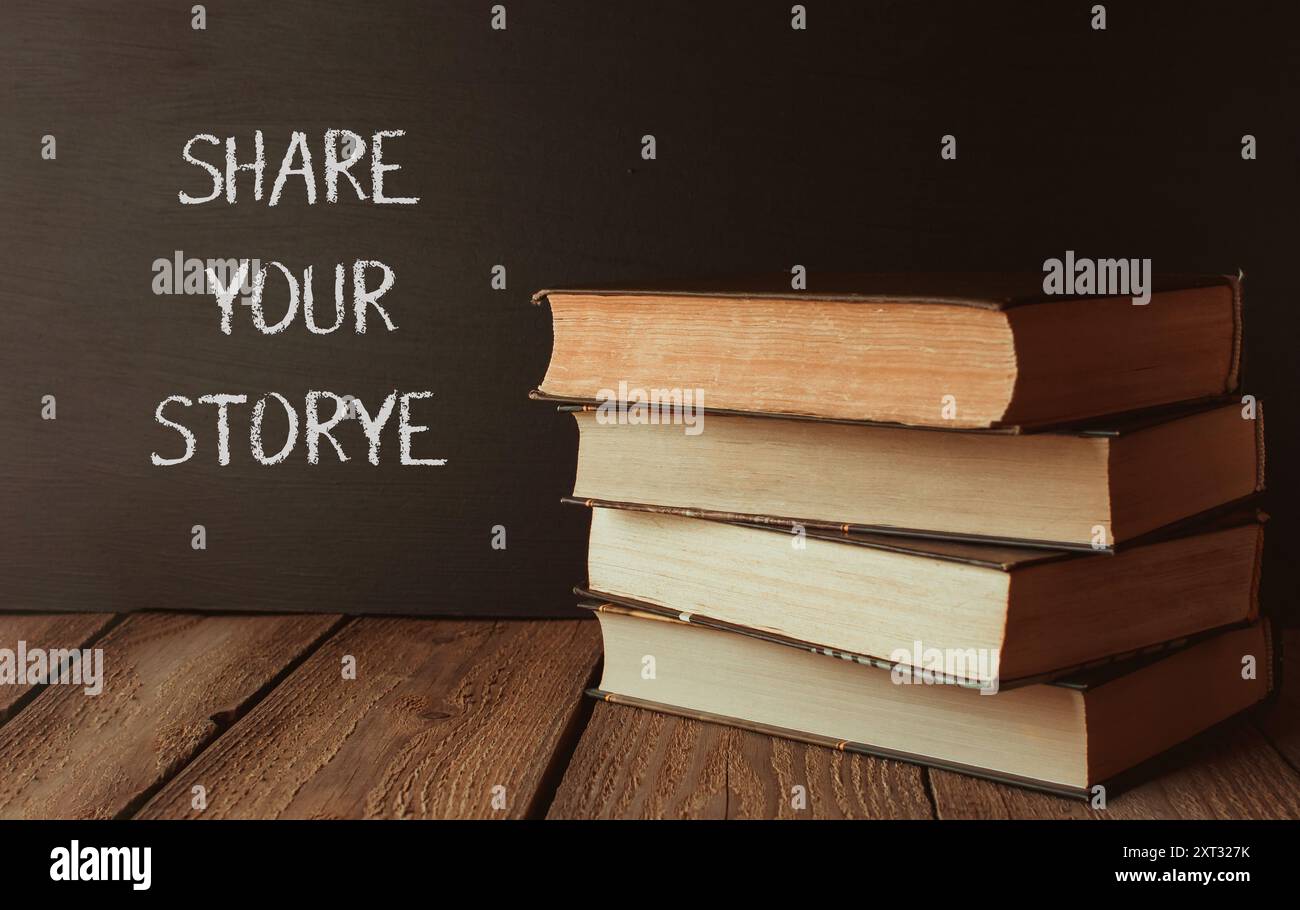 A stack of books with the words share your story written on a ...