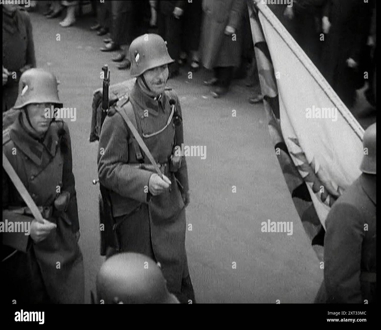 German Soldiers Marching Down a Street as a Crowd Watches, 1930s. From ...