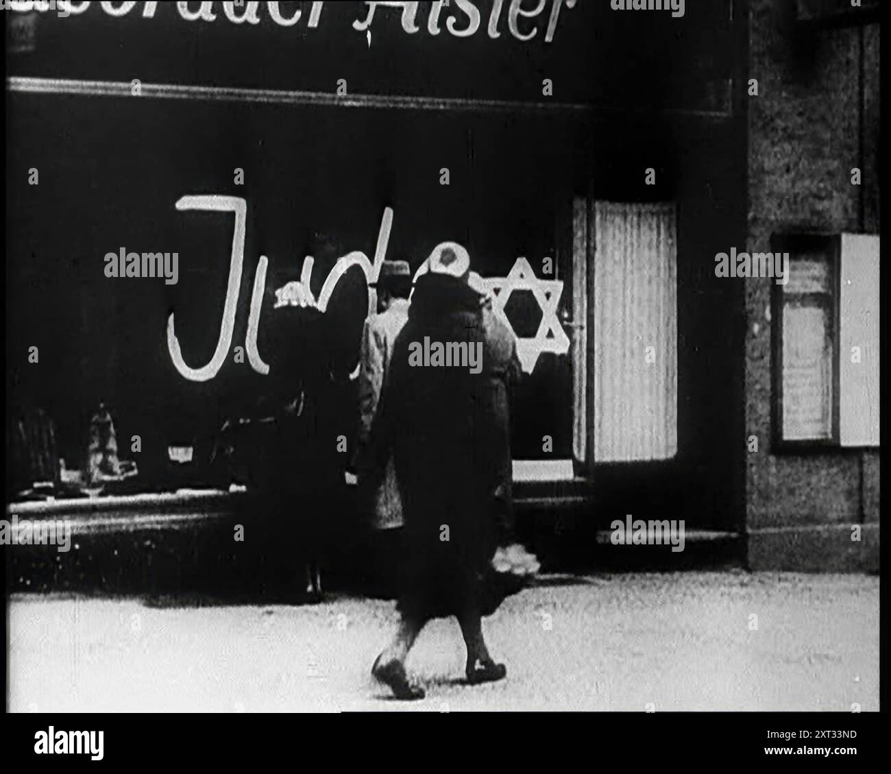 Civilians Looking at Shop Window with Graffiti Reading: 'Juden' on it ...