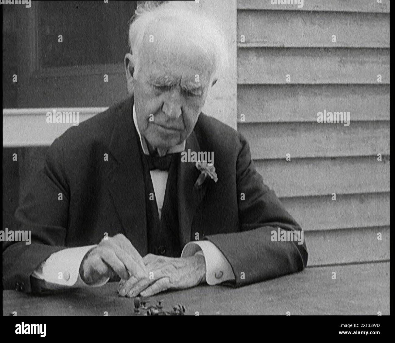 Thomas Edison Sitting at an Outside Desk and Operating a Morse Code Sender, 1921. From "Time To ...
