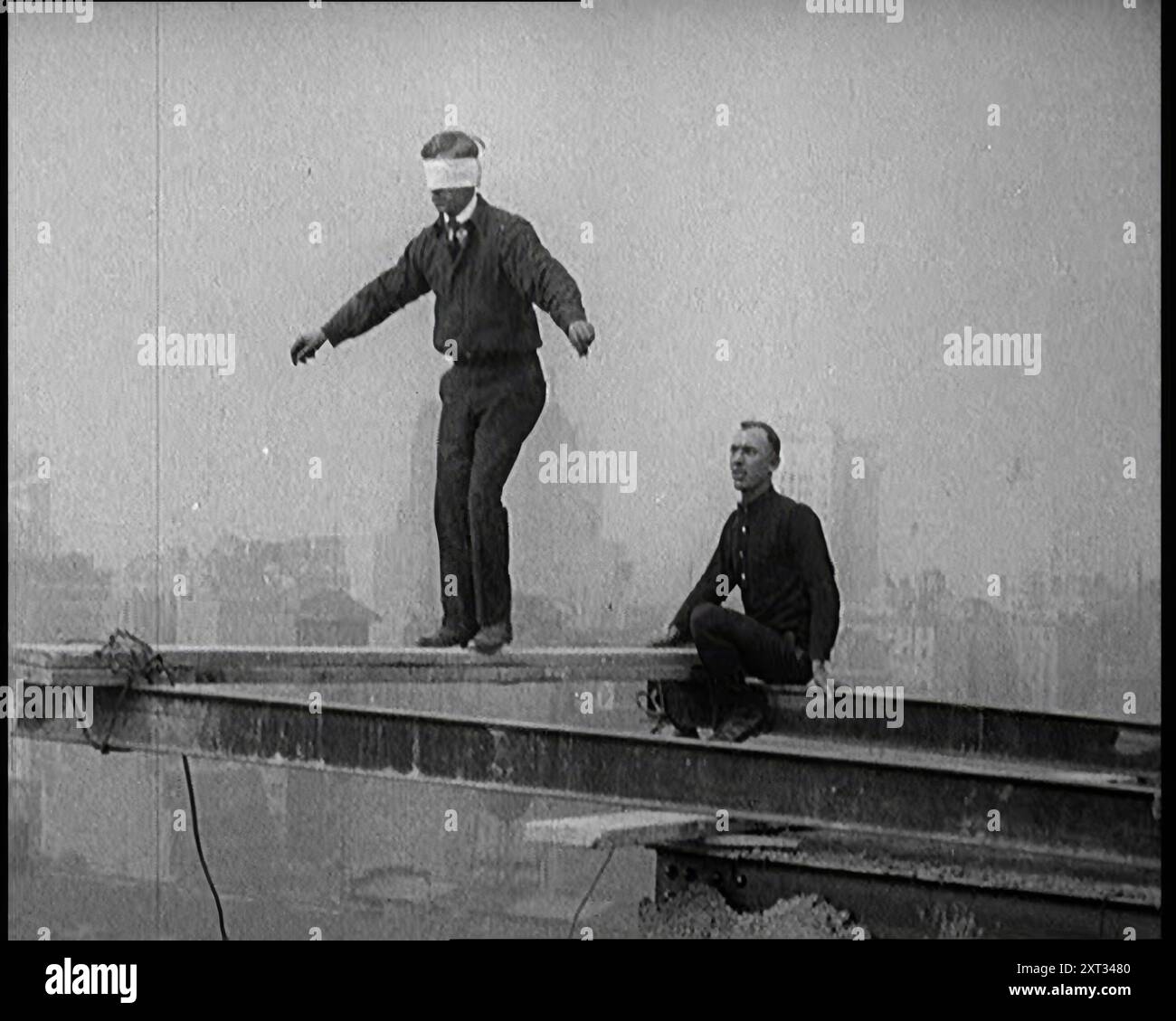 Blindfolded Man Walking Across a Plank Suspended from Iron Girders High ...