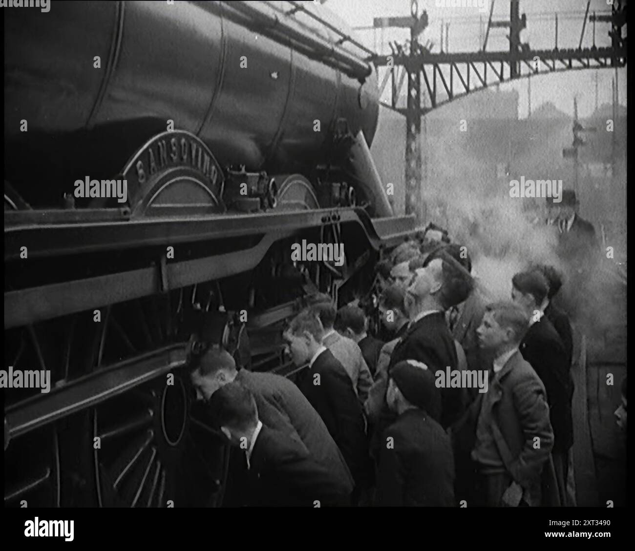 Boys Staring at a Steam Locomotive, 1931. 'Did you ever take engine ...