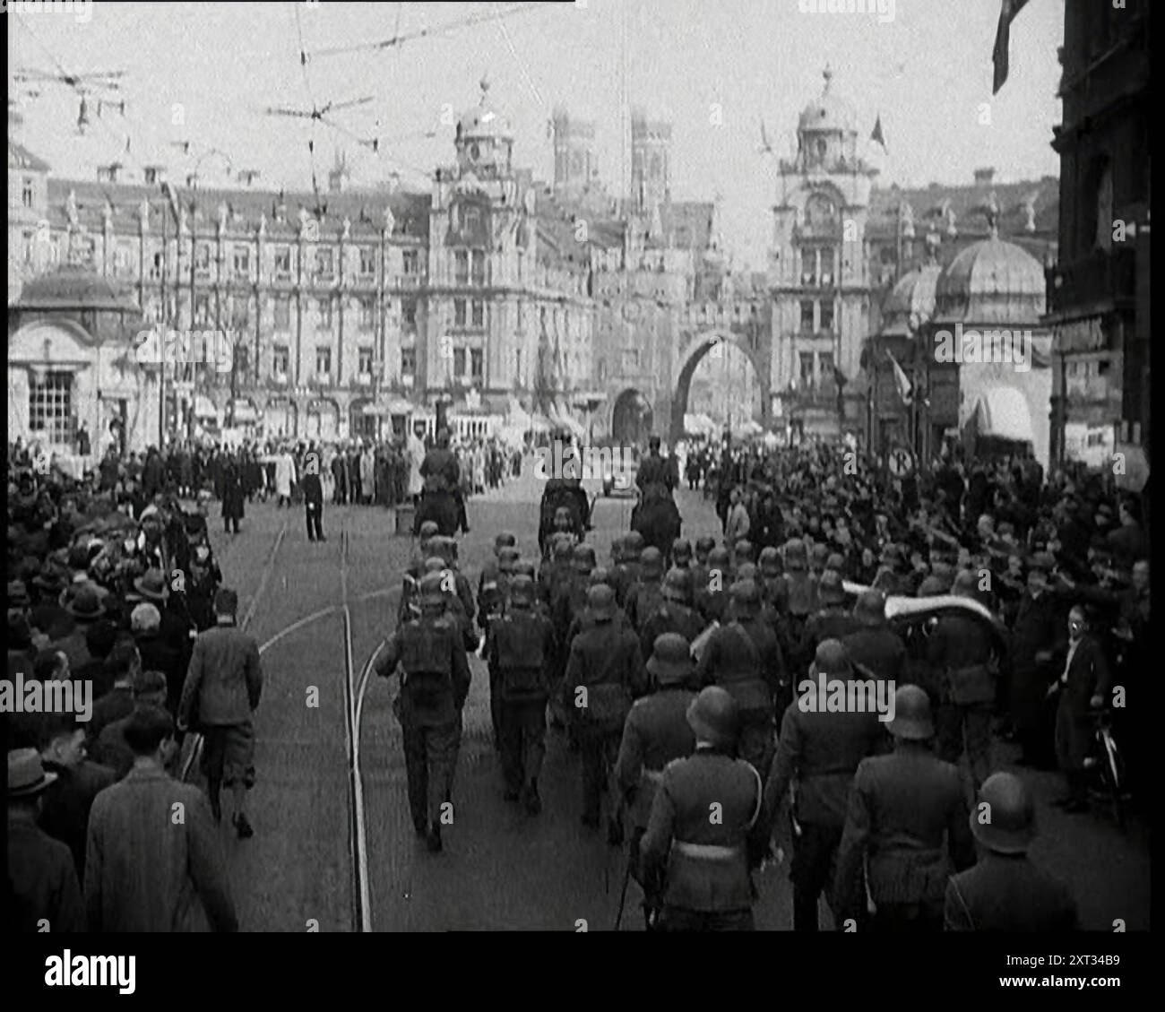 German Soldiers Marching Down a Street as a Crowd Watches, 1930s. From ...
