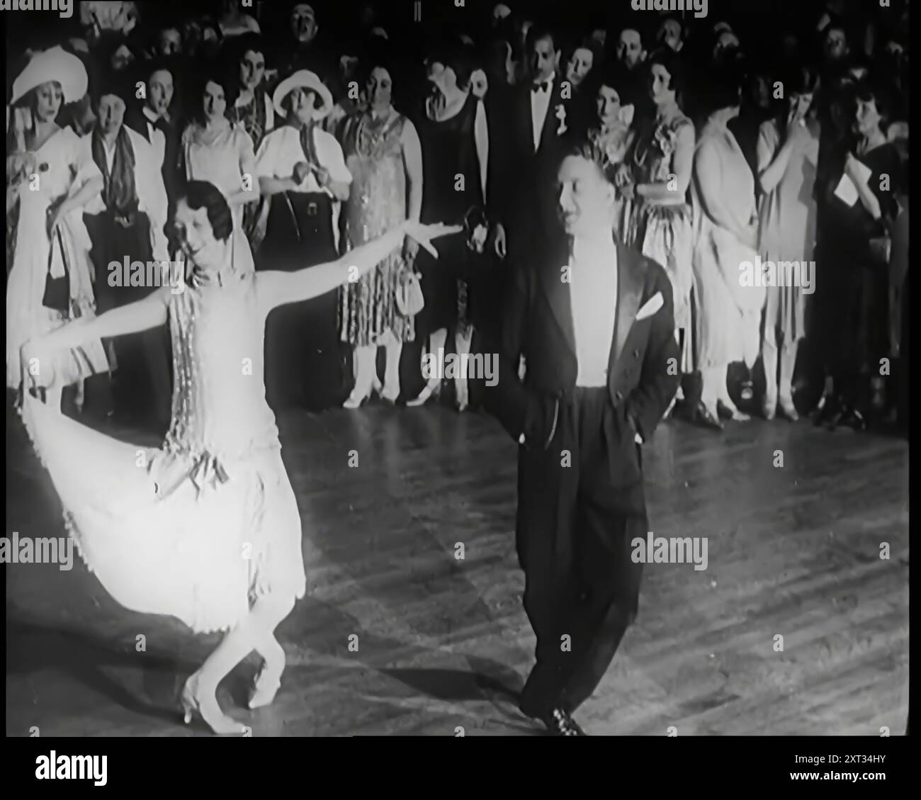 Female Civilian and Male Civilian Dancing in Front of a Crowd of People, 1926. From "Time To ...
