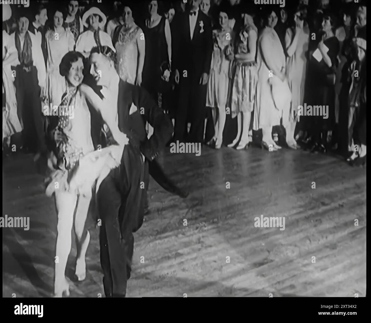 Female Civilian and Male Civilian Dancing in Front of a Crowd of People, 1926. From "Time To ...