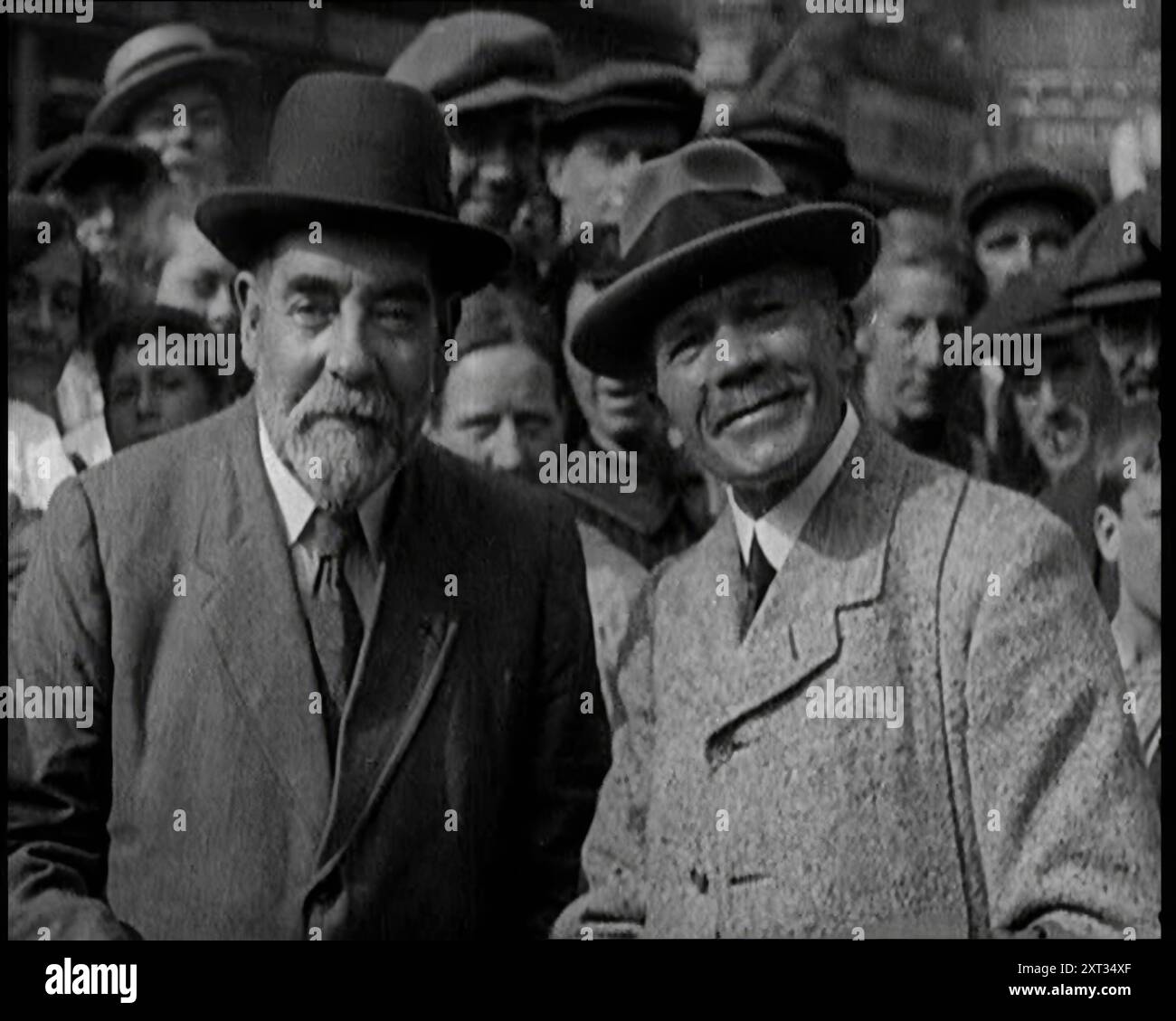Two Labour Politicians Talking to Each Other, Surrounded by Supporters ...