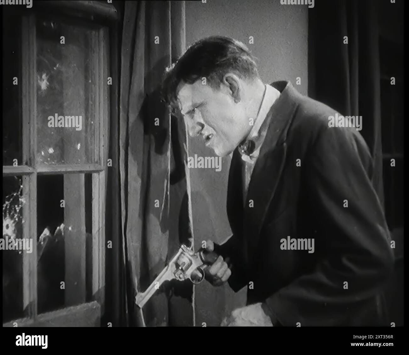 Scene From the Film 'The Informer': Male Actor Shooting a Gun Out of a ...