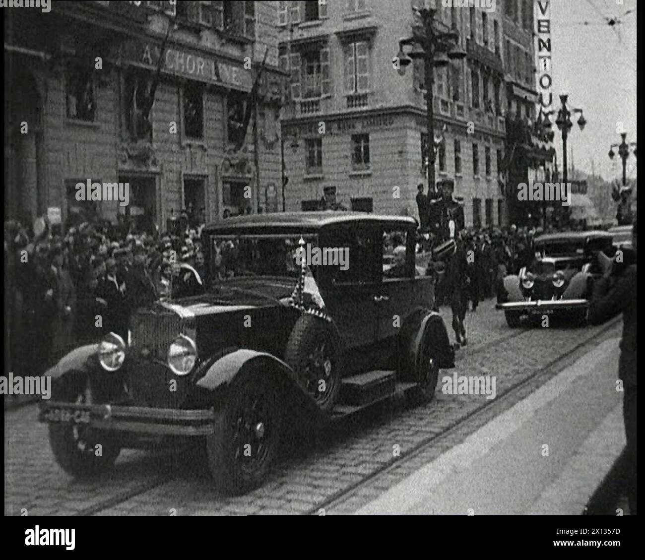 Cars Driving Down a Road, Watched by a Crowd, 1934. From "Time To ...