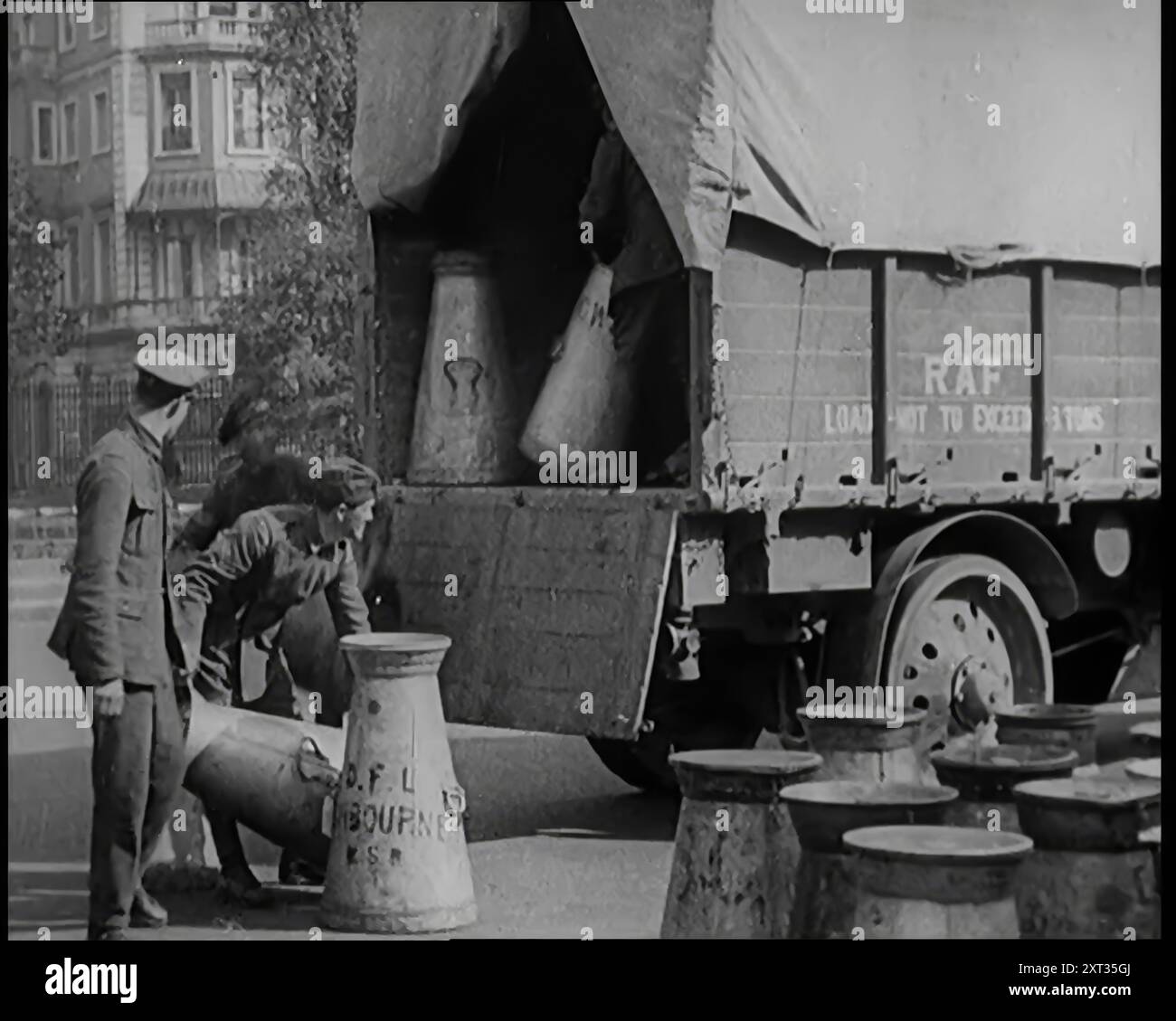 Milk Churns Being Loaded Onto a Lorry by Male Soldiers, 1926. From "Time To Remember 1926 ...