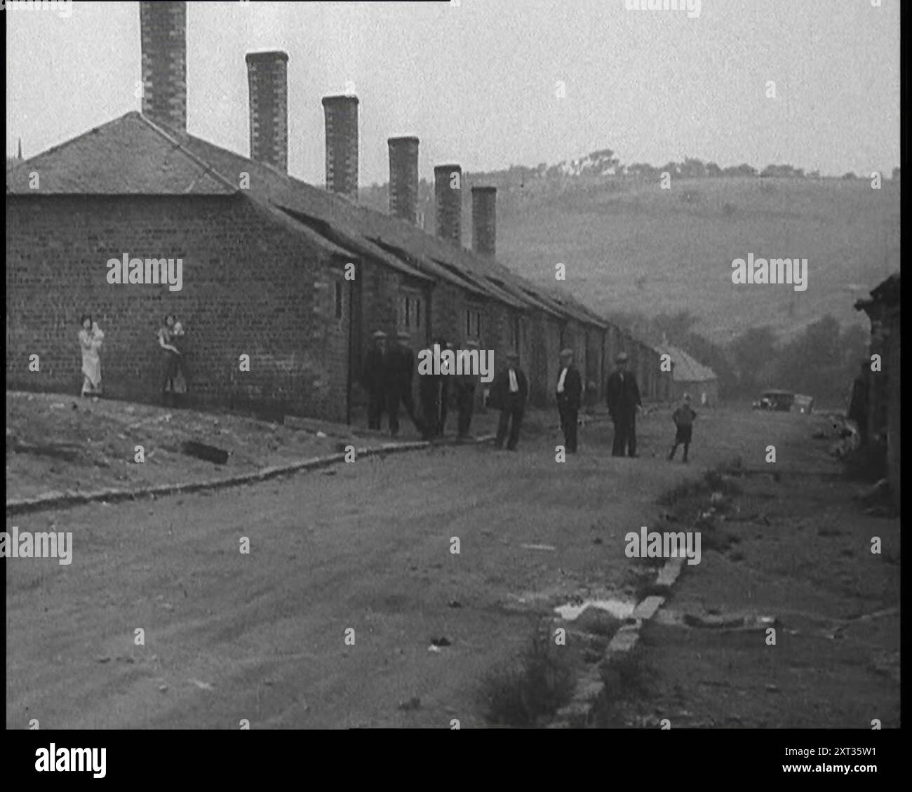 Group of Men, Women and Children Standing Around on a Street, 1933. The ...