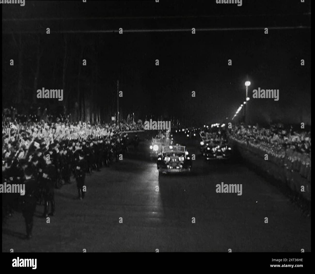 Nazi Party Staff Cars Driving Down a Wide Road in Berlin with cheering ...