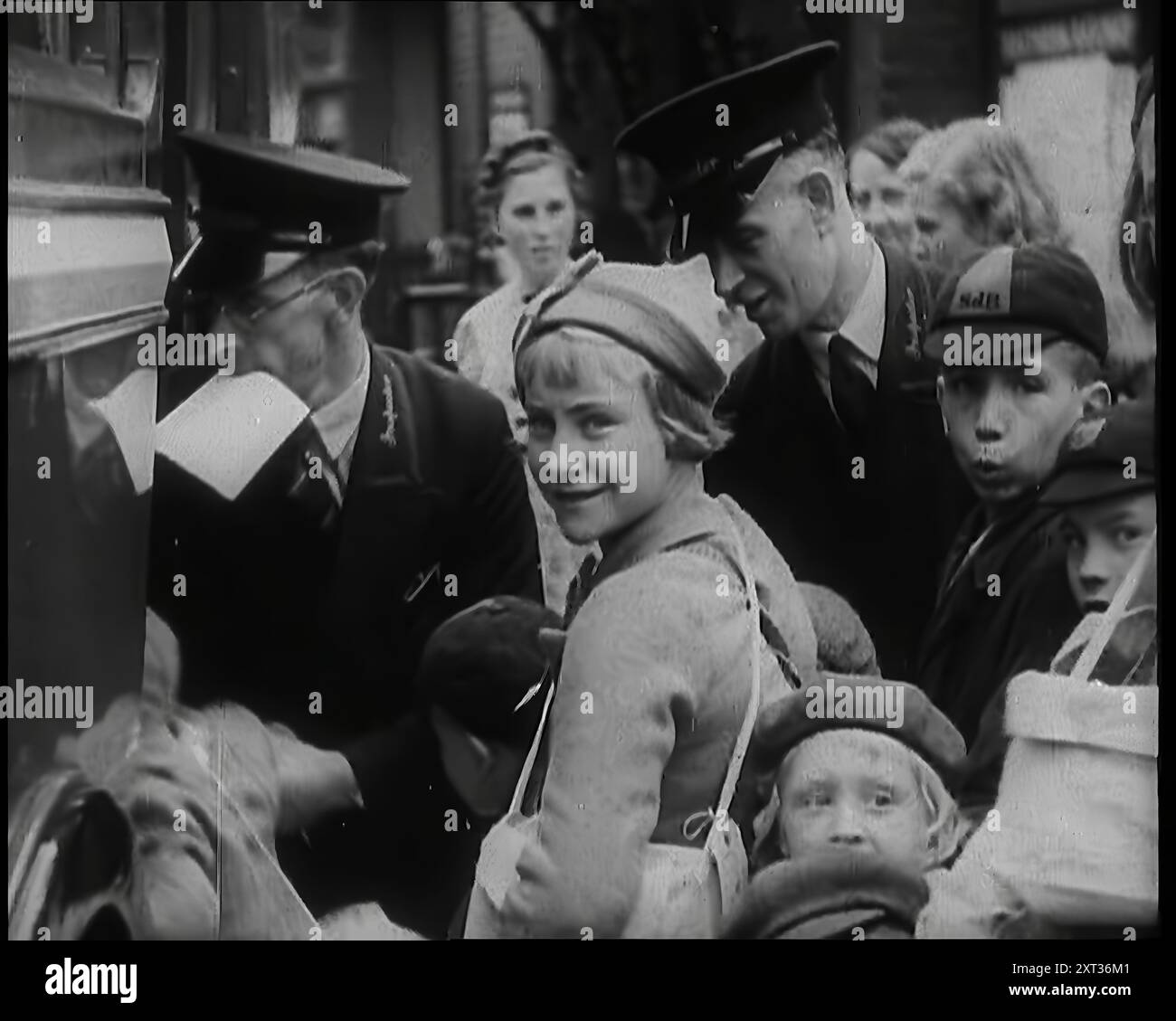 British Male and Female Evacuees Waiting to Board a Bus With Two Male ...