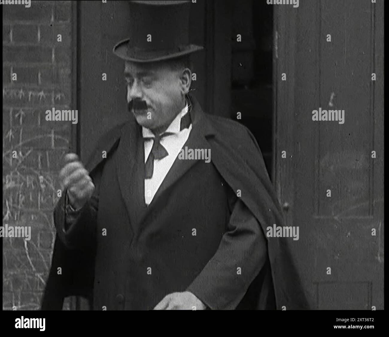 Theatre Star Billy Bennett Walking Out of a Doorway, He Tosses a Coin ...