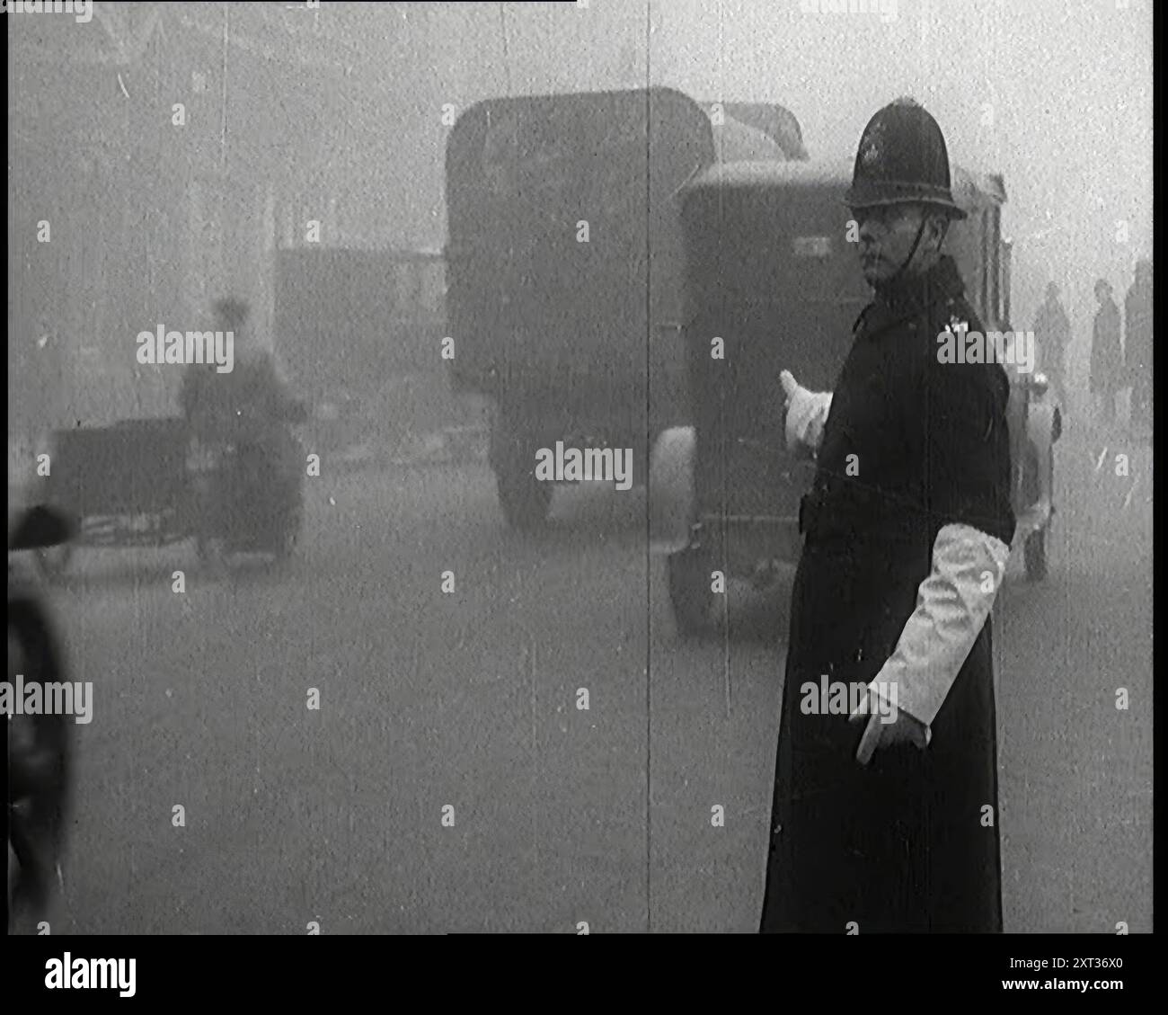 Male British Police Officer Controlling the Traffic On the Streets of ...
