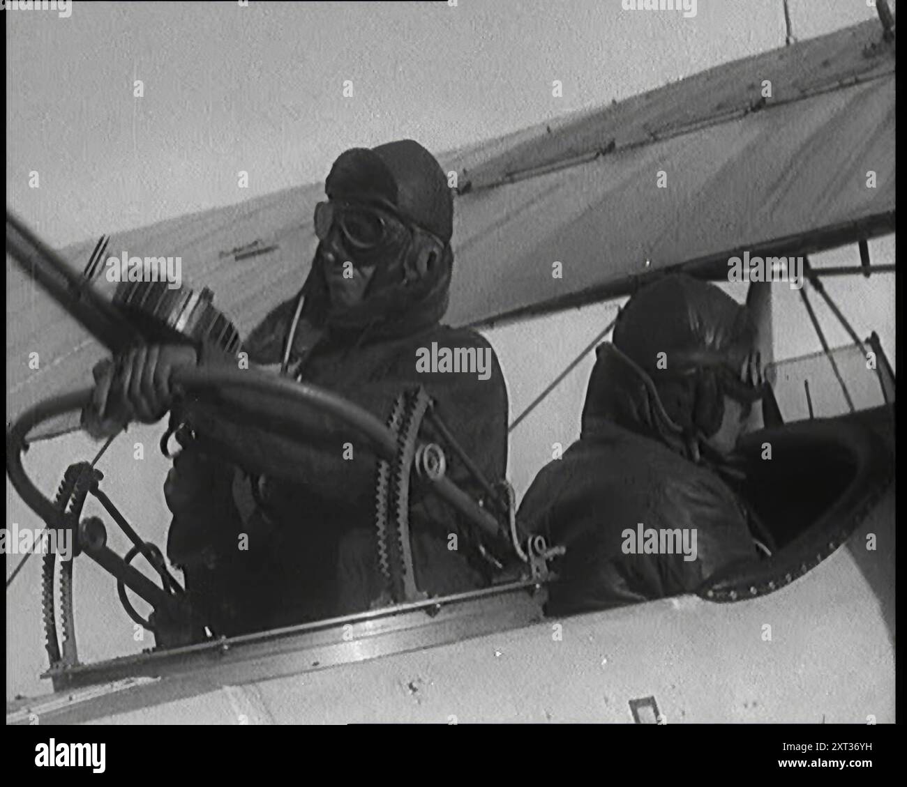 Male British Pilots On Board a Plane And Mounting a Machine Gun, 1920s ...
