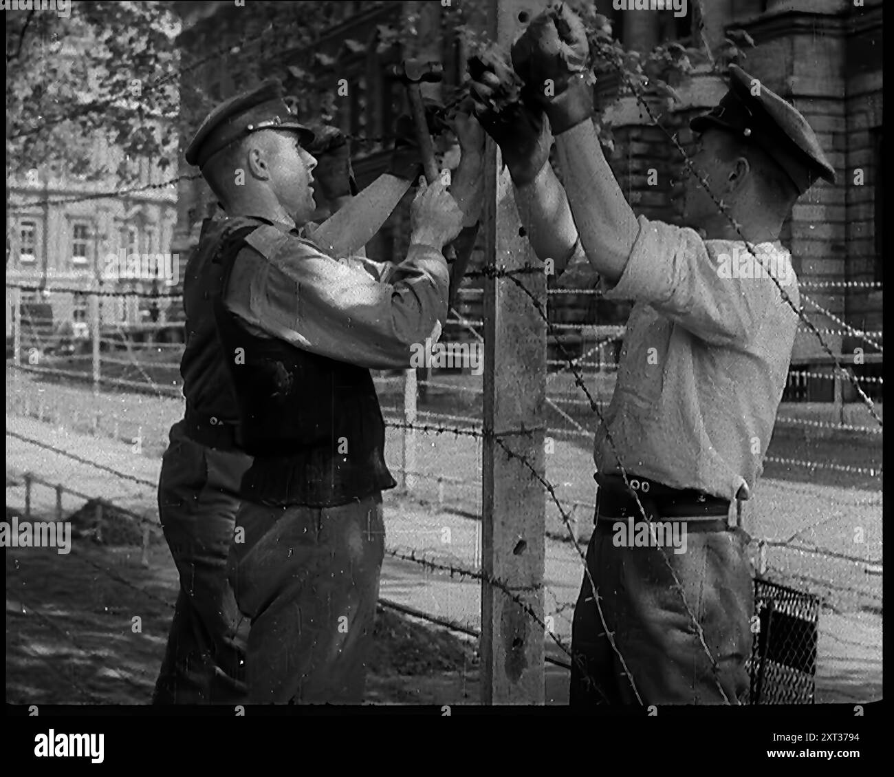 Three Men Setting up a Barbed Wire Fence, 1940. Britain during the ...