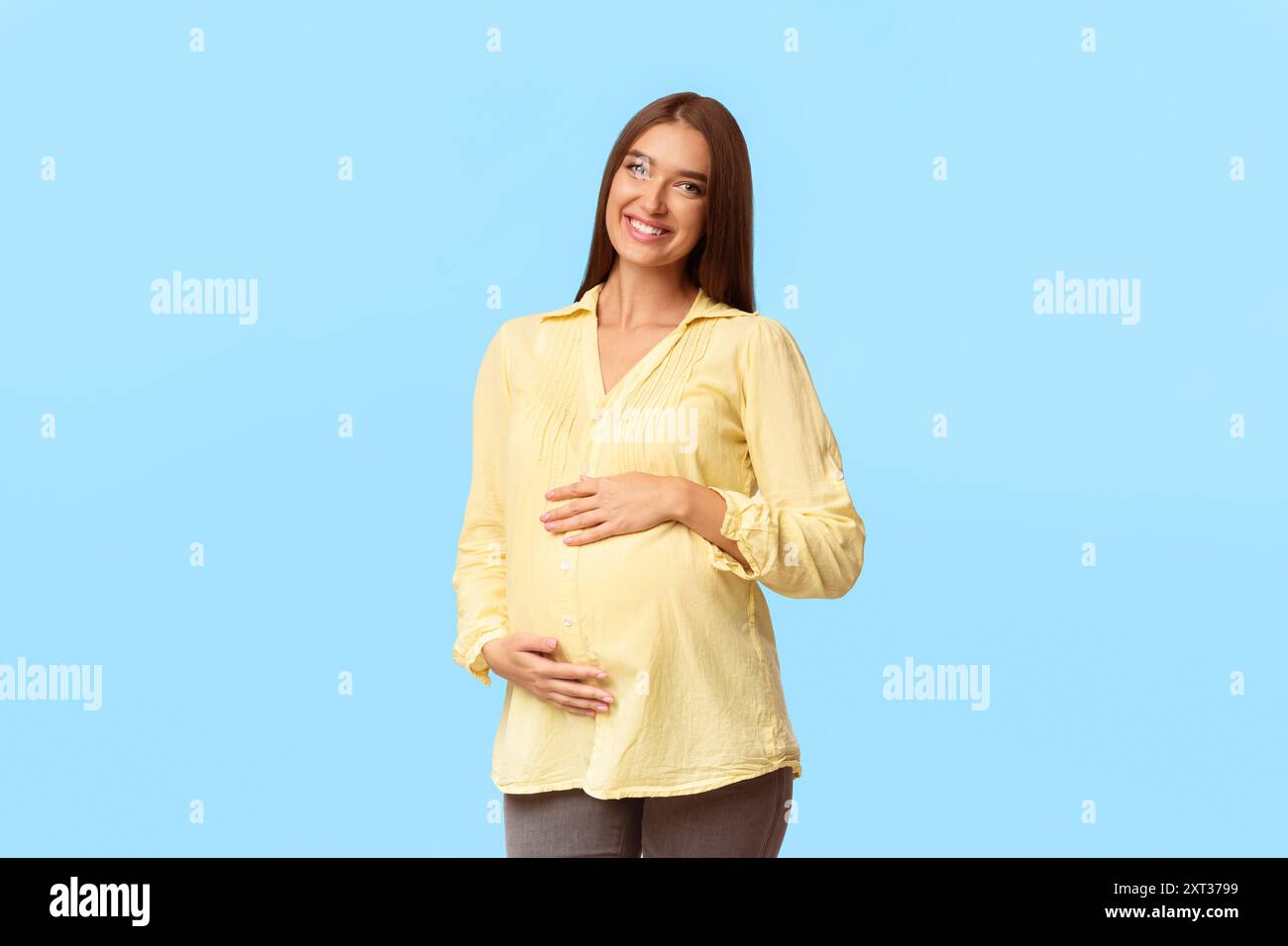 Pregnant Lady Smiling To Camera Touching Belly Over White Background ...