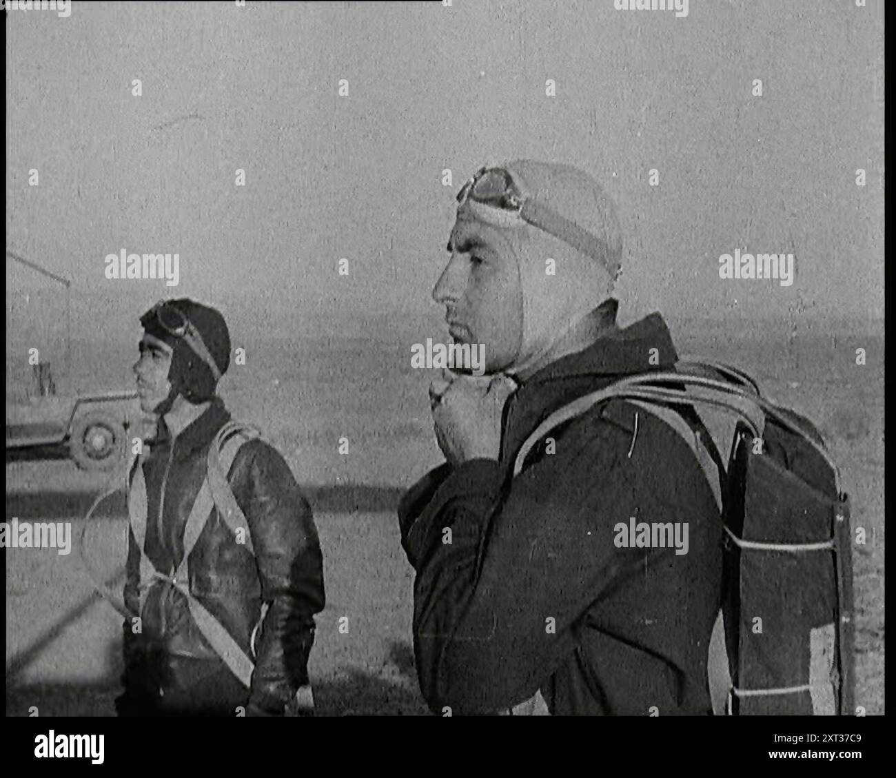 Pilot and Rear Gunner of Biplane Readying Themselves To Board Their ...