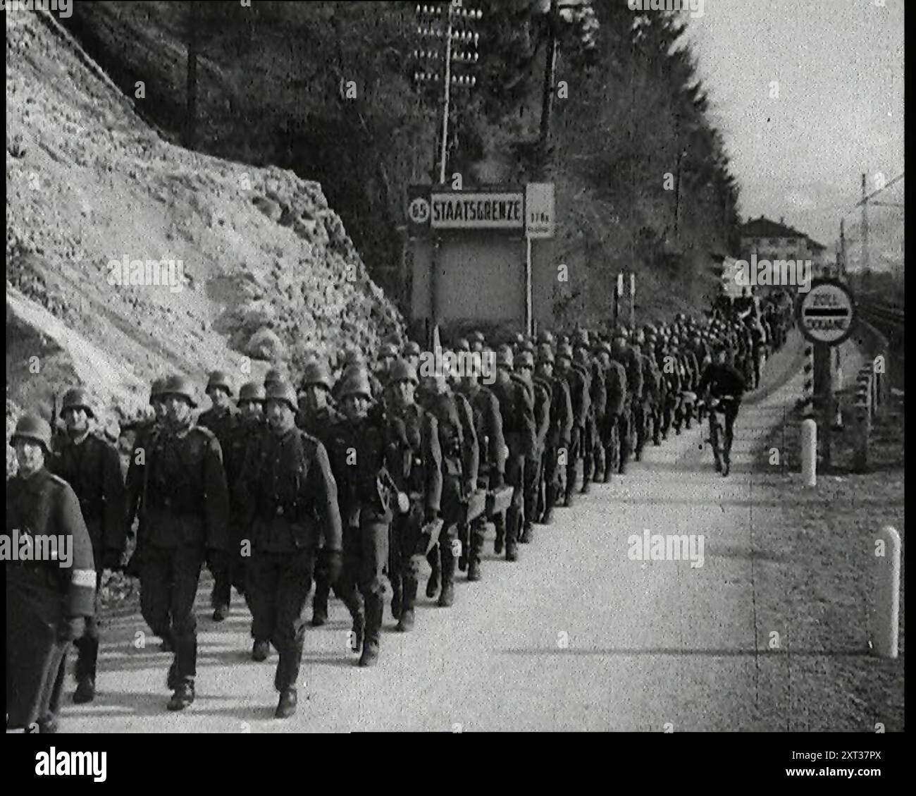 A Line of Male German Soldiers Marching Through a Customs Point ...