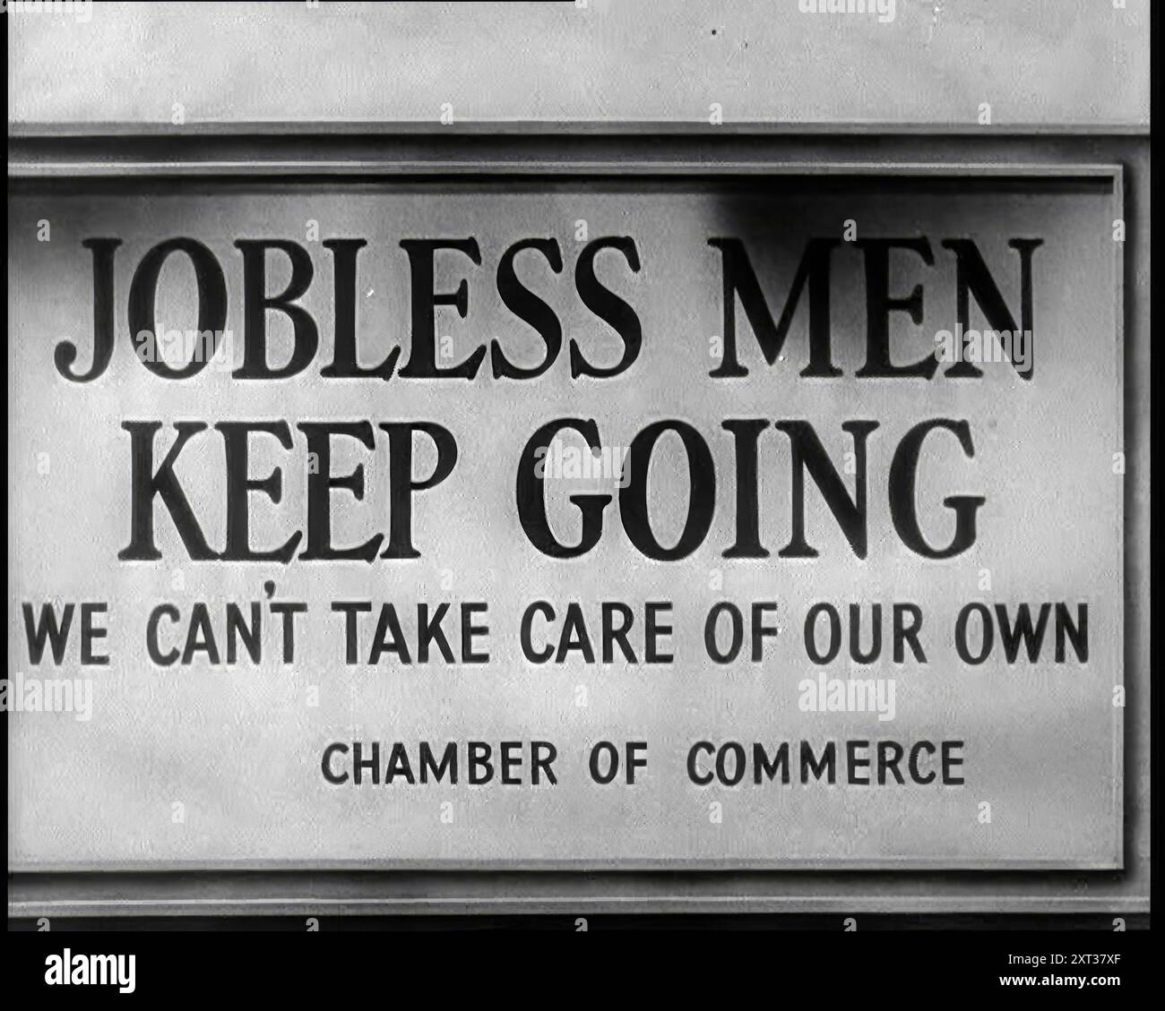 Sign reads: 'Jobless Men Keep Going - We Can Take Care of Our Own ...