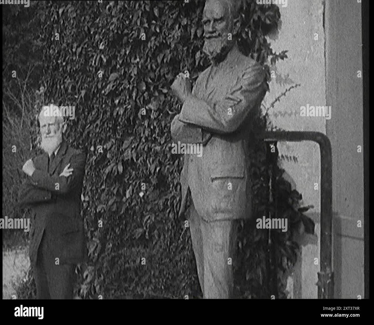 Playwright George Bernard Shaw Standing Next To a Statue of Himself ...