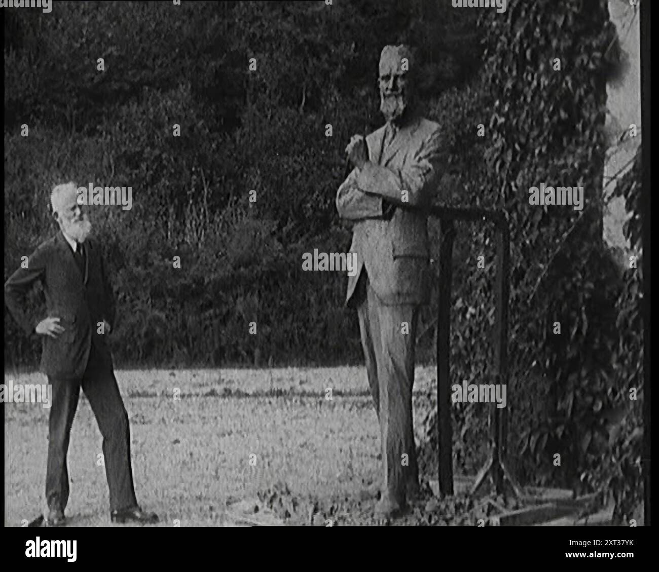 Playwright George Bernard Shaw Standing Next To a Statue of Himself ...