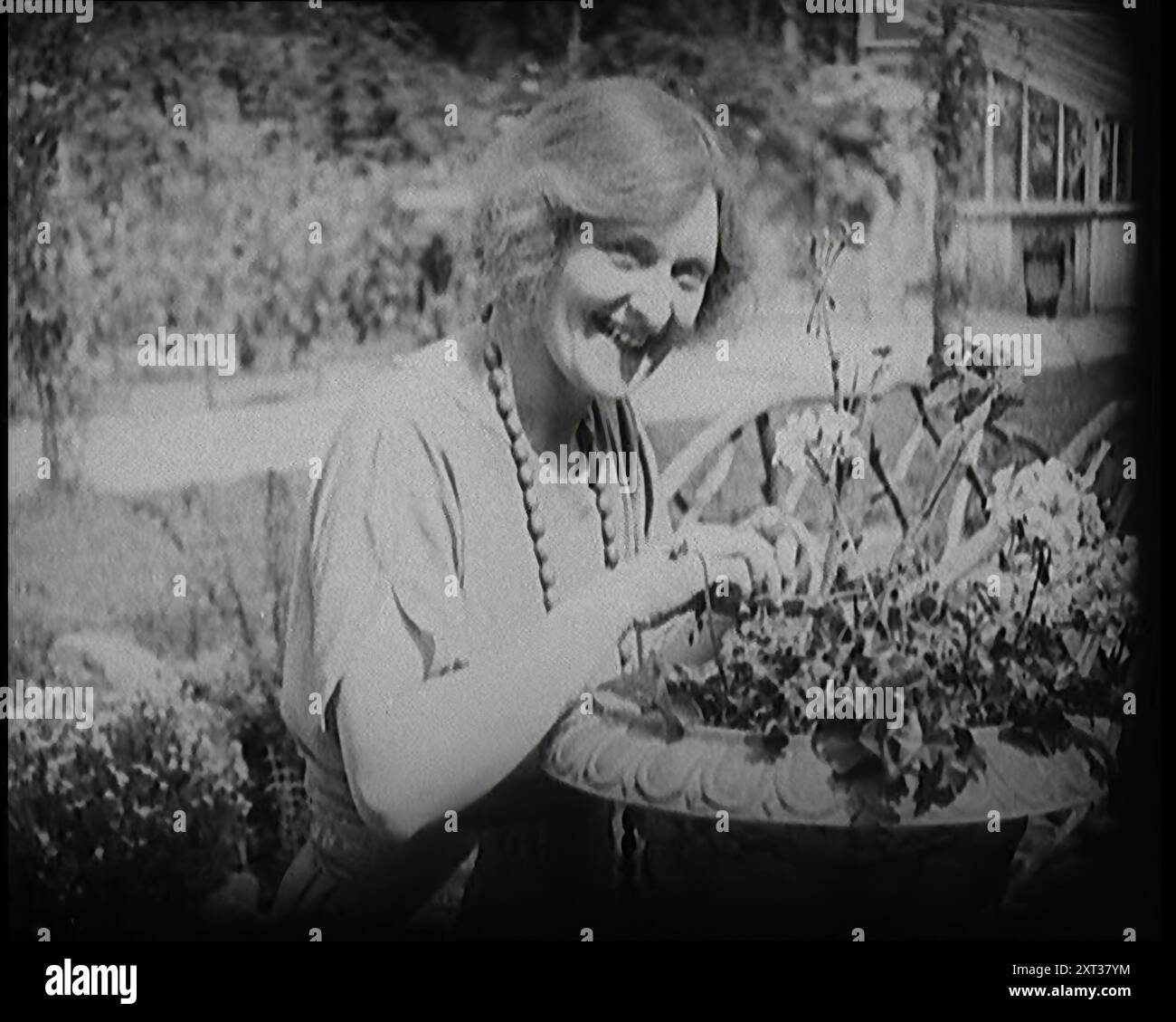 The Actress Sybil Thorndike Tending Her Flowers in a Garden, 1920s ...