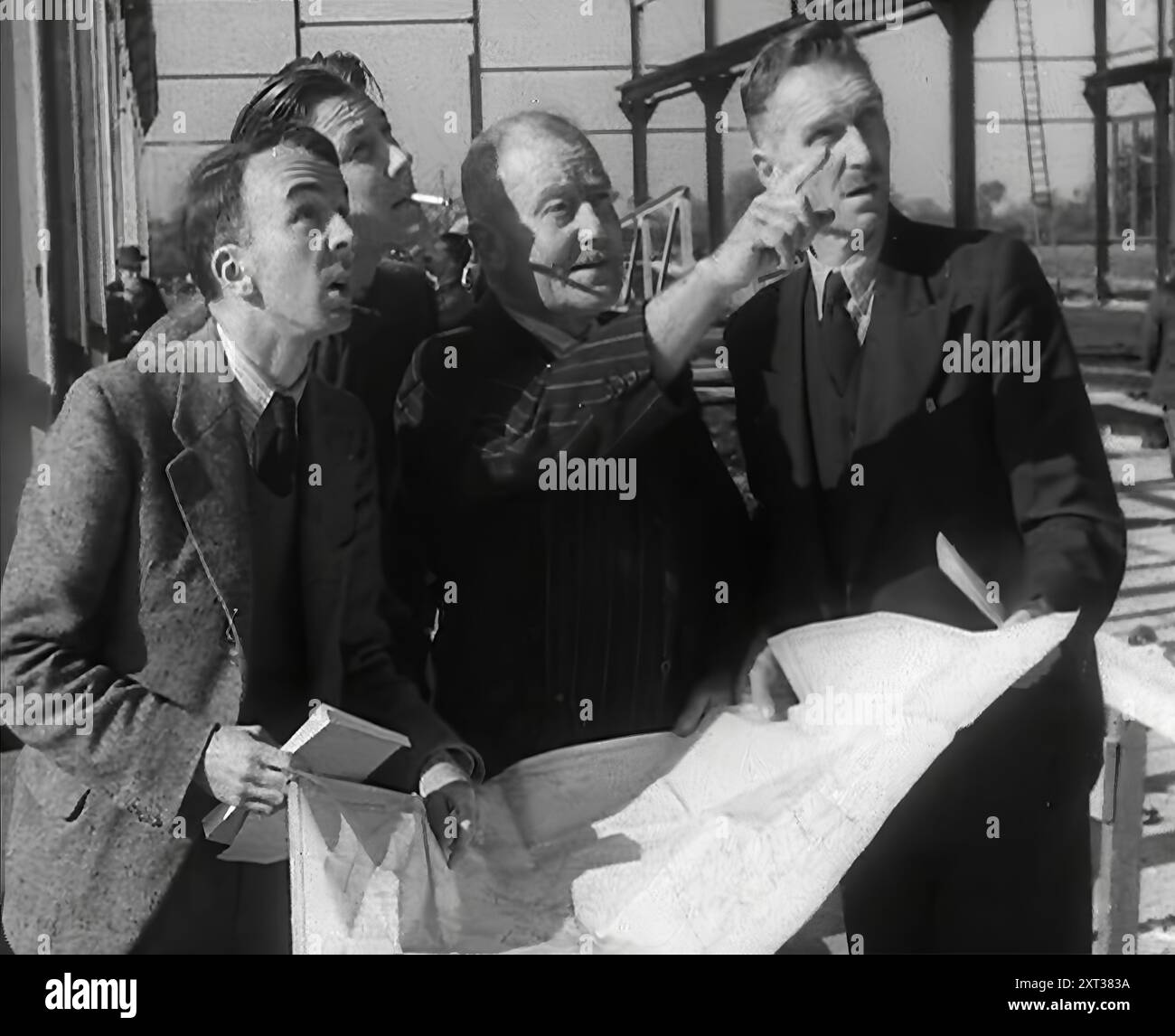American Engineers Going Over Construction Plans of a Hangar at an ...