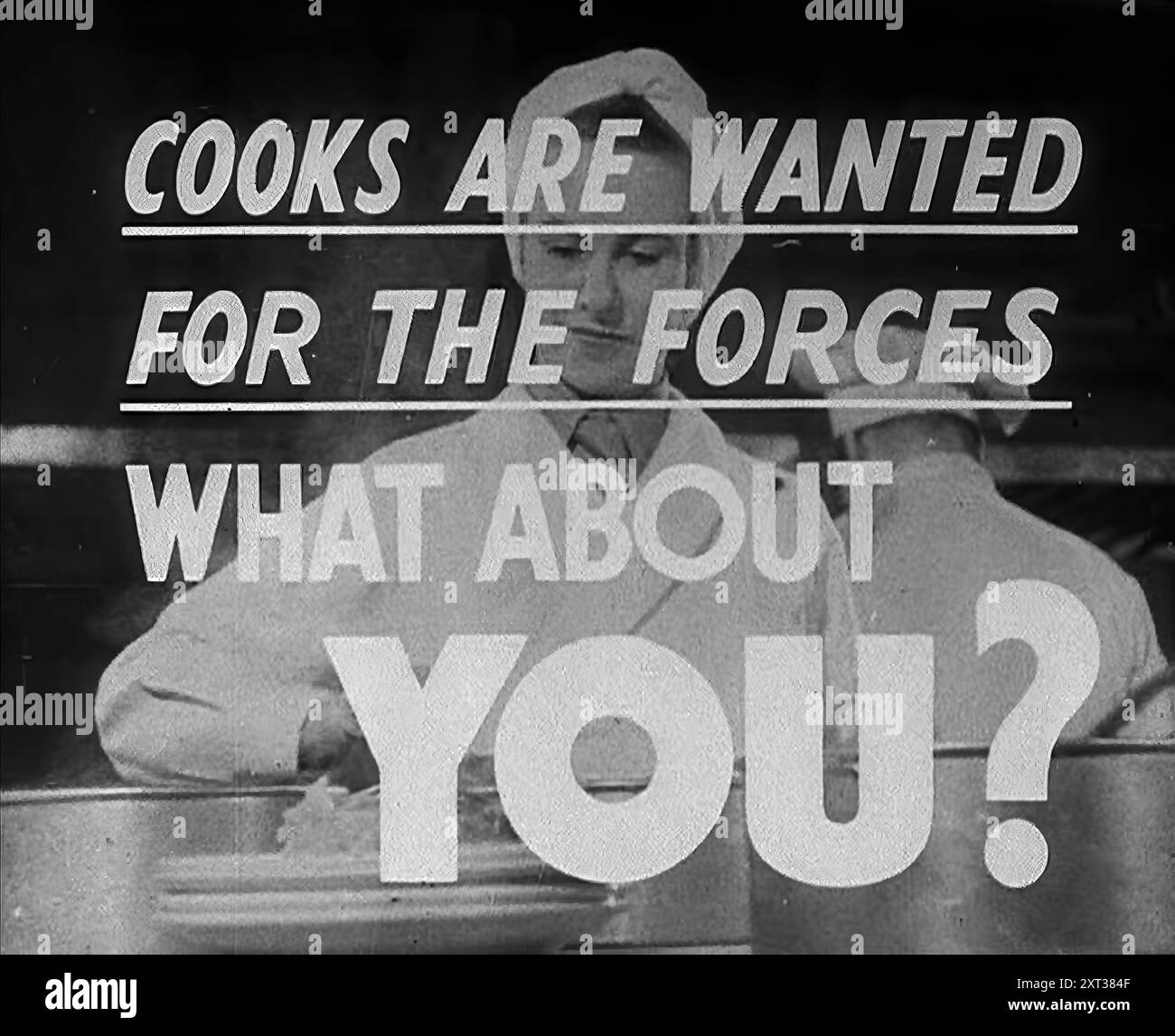 Two Cooks With a Recruitment Slogan on the Screen: Cooks are wanted for ...