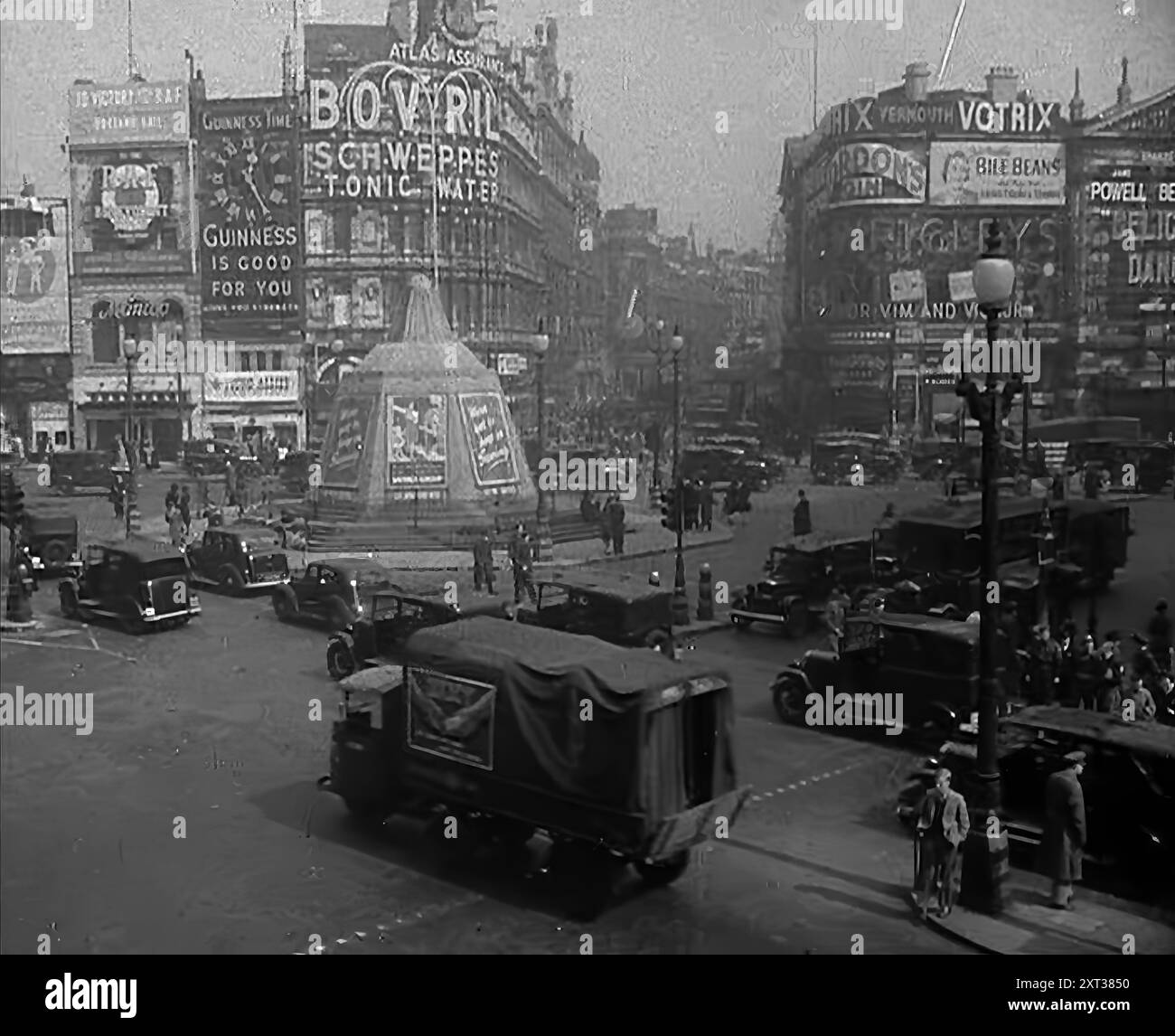 People and Traffic Moving Through a Busy Junction in London, 1943. Note ...
