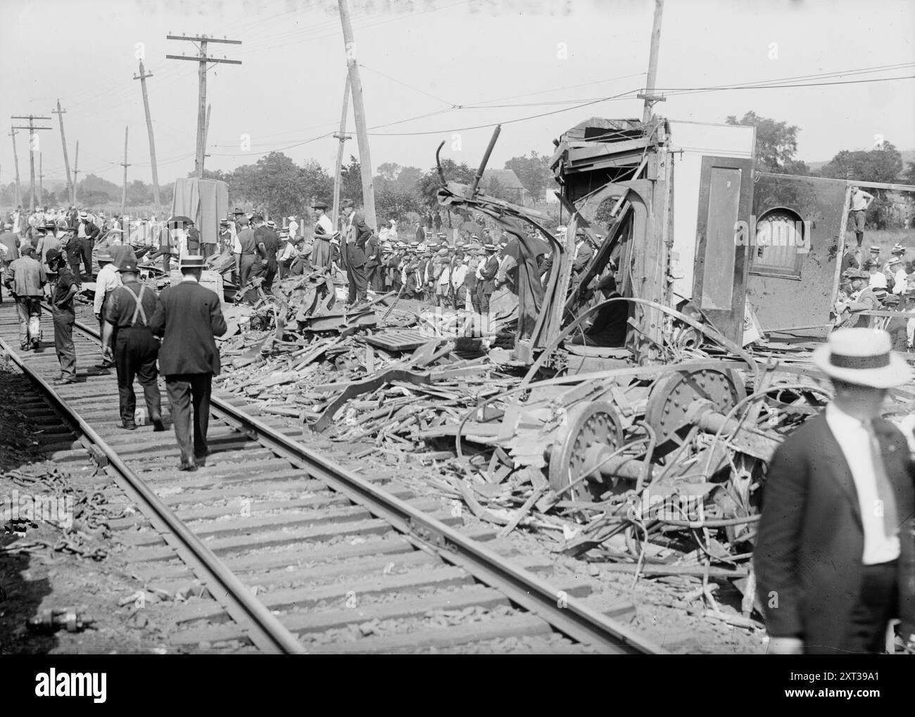 Wreck of Bar Harbor express, 1913. Shows people looking at wrecked ...