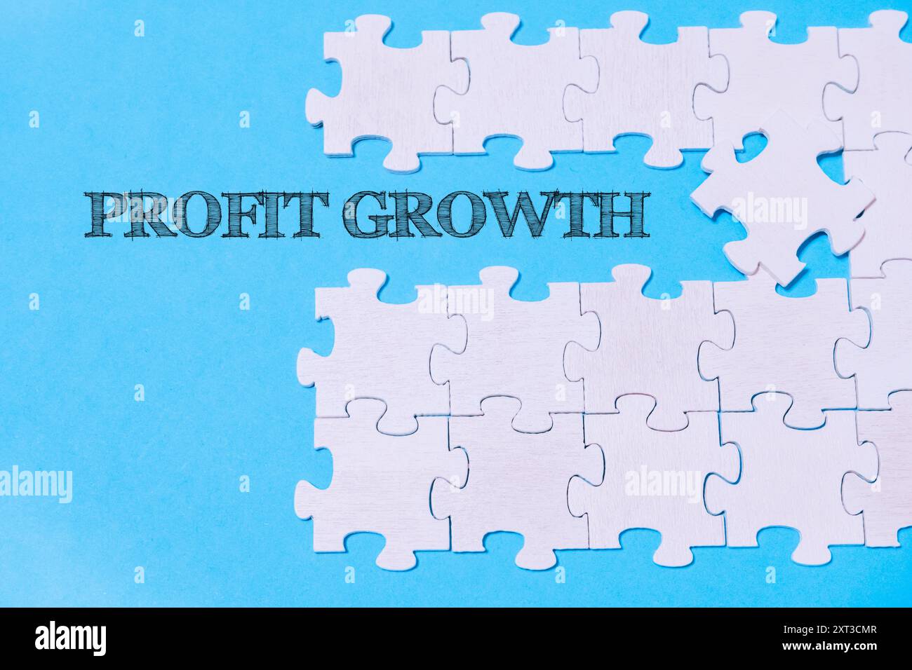 A jigsaw puzzle with the word profit growth written on it Stock Photo ...