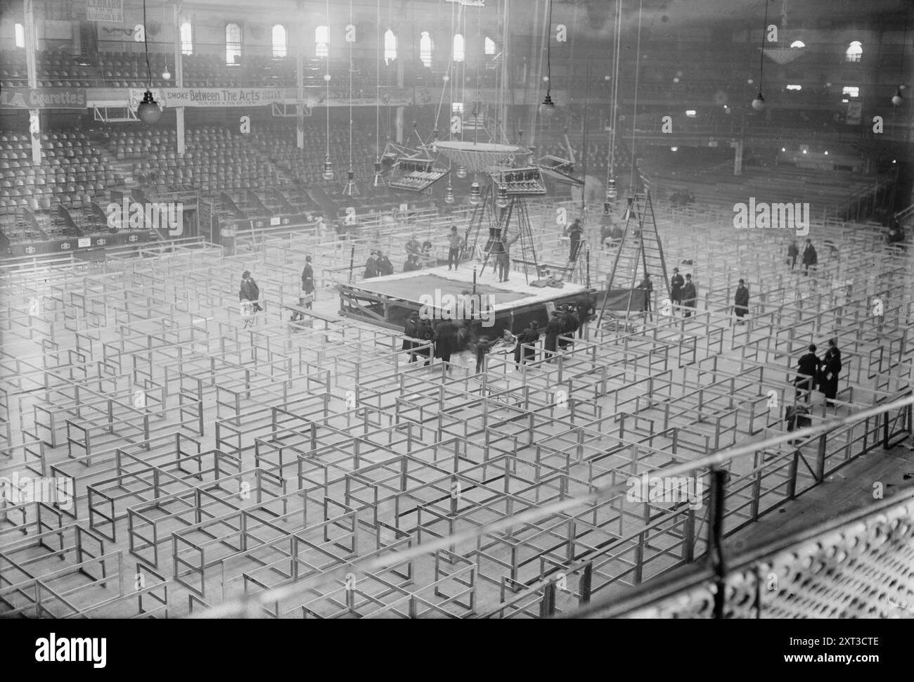 Madison Sq. Garden, 1916. Shows crews preparing the ring for the boxing ...