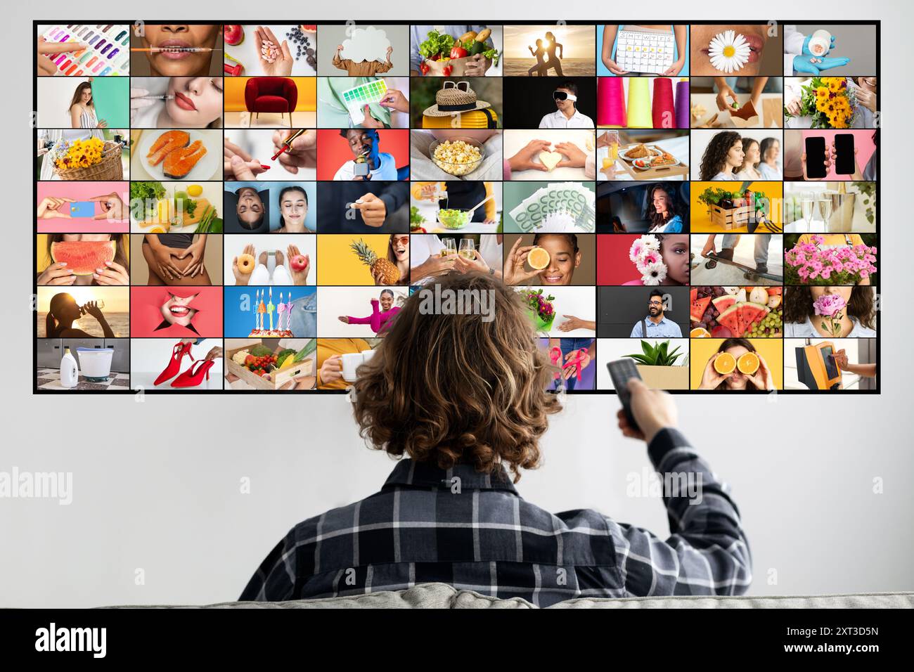 Young Person Watching A Screen With Colorful Grid Of Images Stock Photo ...