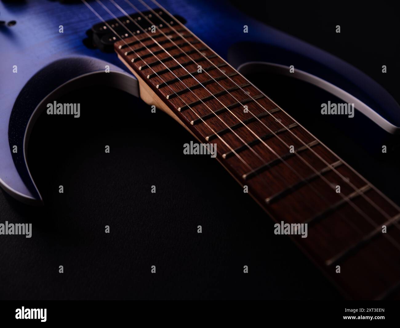 Fretboard of modern electric guitar. Close up Stock Photo - Alamy