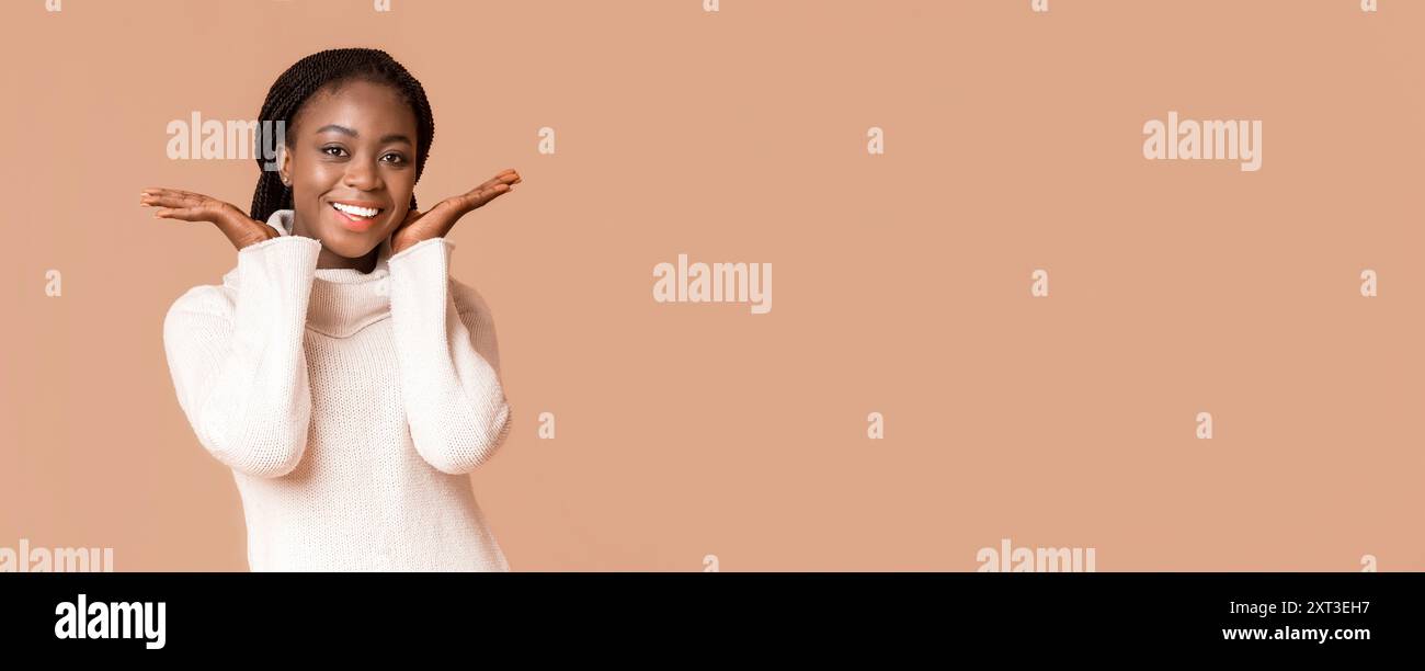 Portrait of joyful black woman touching her cheeks with hands Stock ...