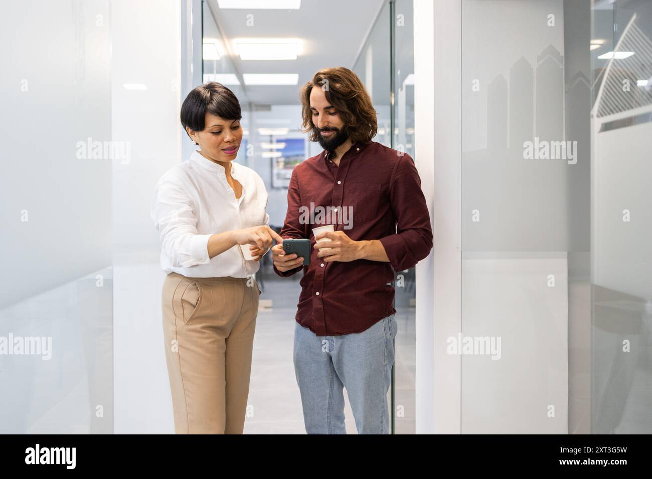 Two professionals engage in coaching hi-res stock photography and ...