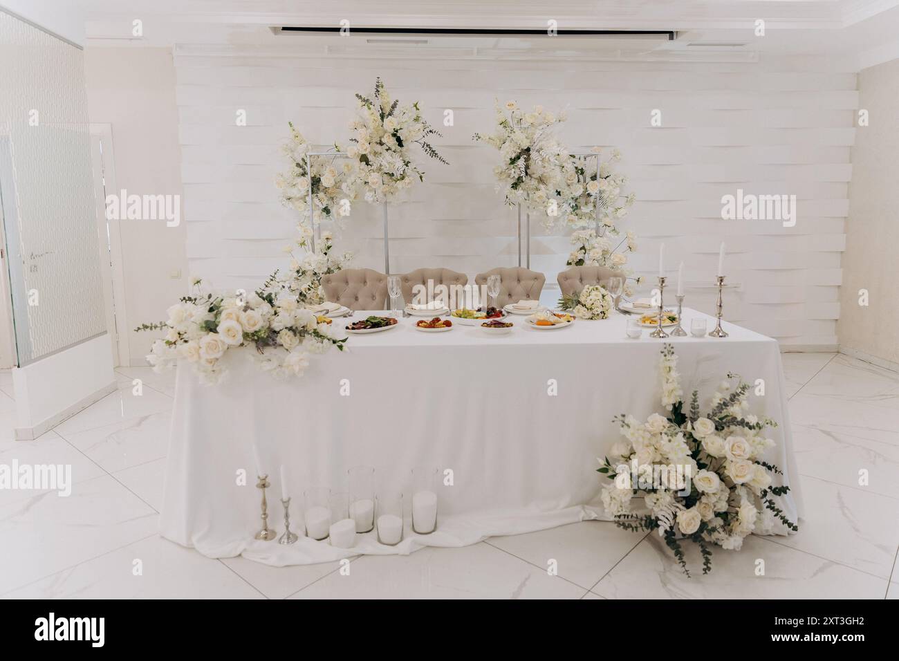 Elegant wedding reception setup with luxurious floral arrangements and ...