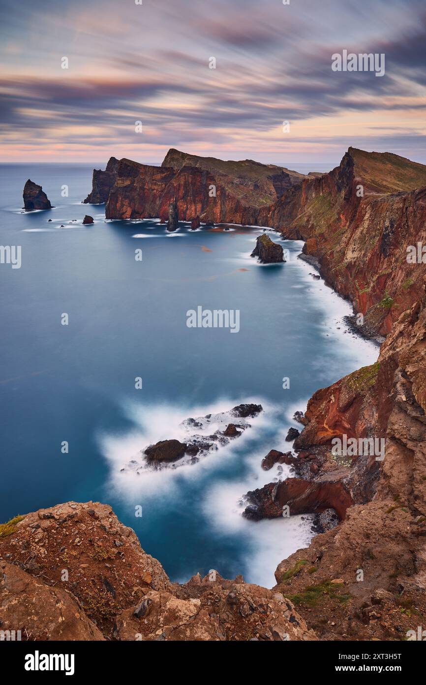 Stunning view of Madeira's dramatic cliff coastline under a sunset ...