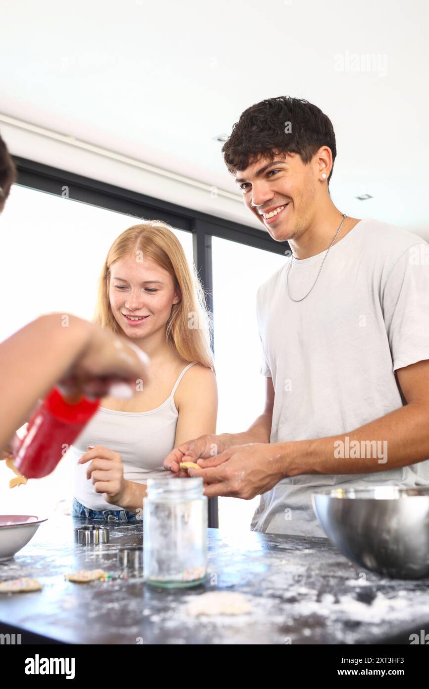 Siblings enjoy a fun cooking session together in their light-filled ...