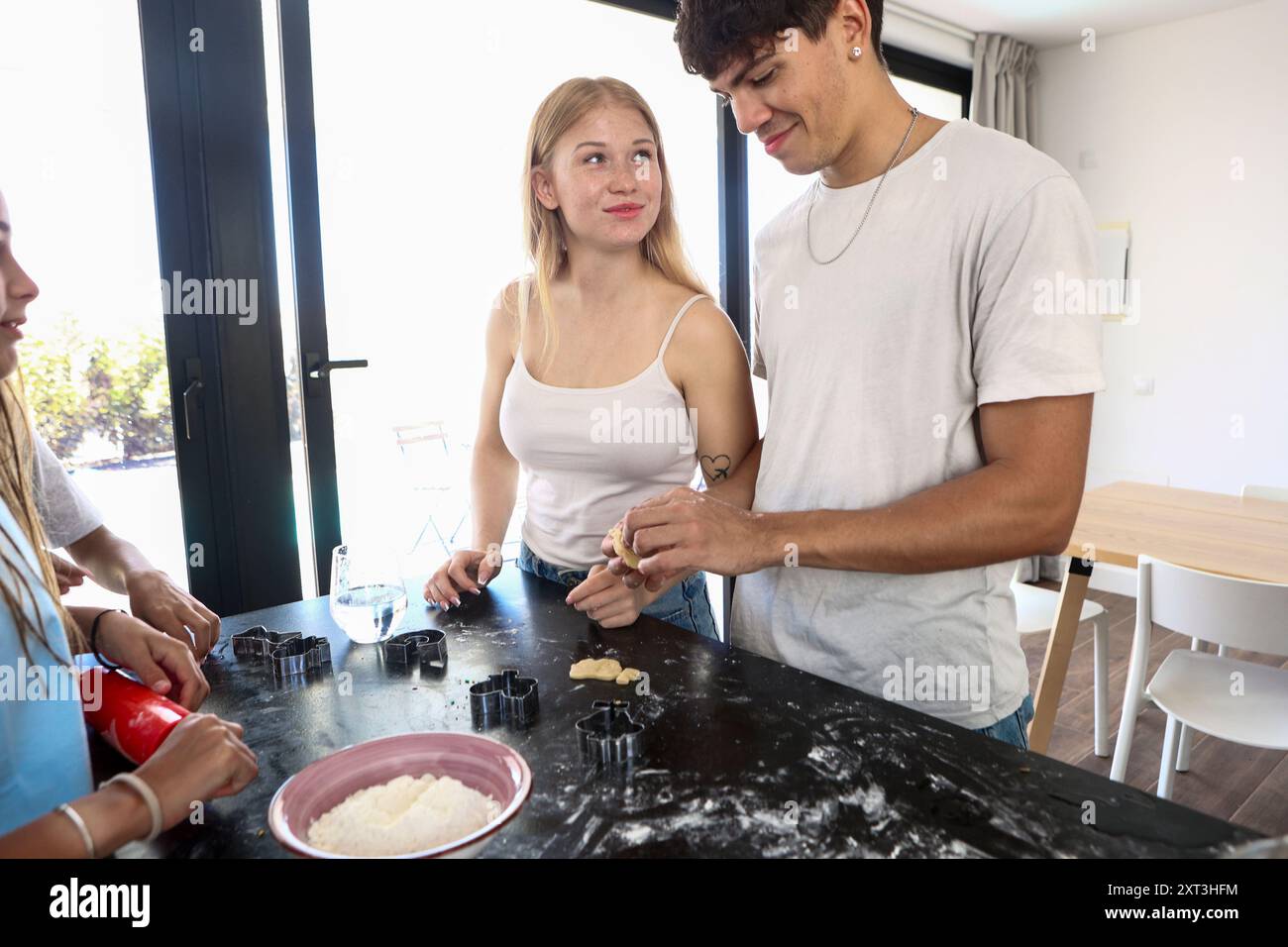 Family enjoy a bonding moment while baking cookies together in their ...
