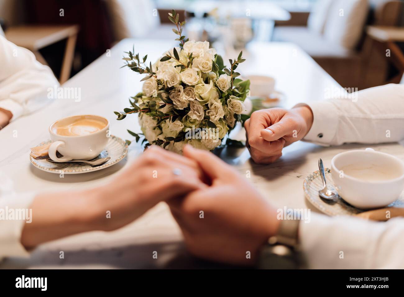 Romantic engagement moment, couple holding hands with rings ...