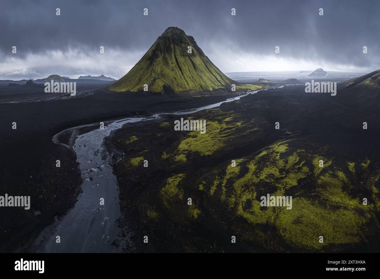 Dramatic aerial view of Maelifell, a distinctly shaped green volcano in ...