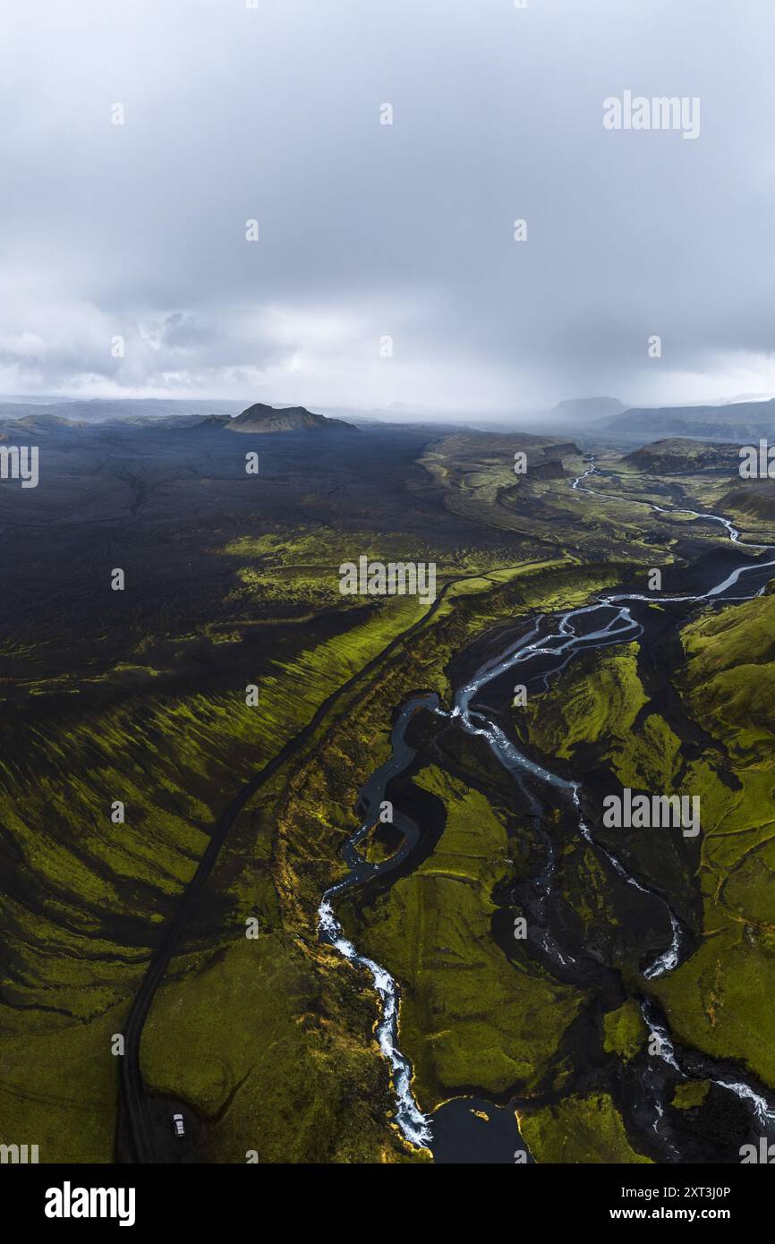 Aerial shot capturing the stark contrasts and vibrant greens of Iceland ...