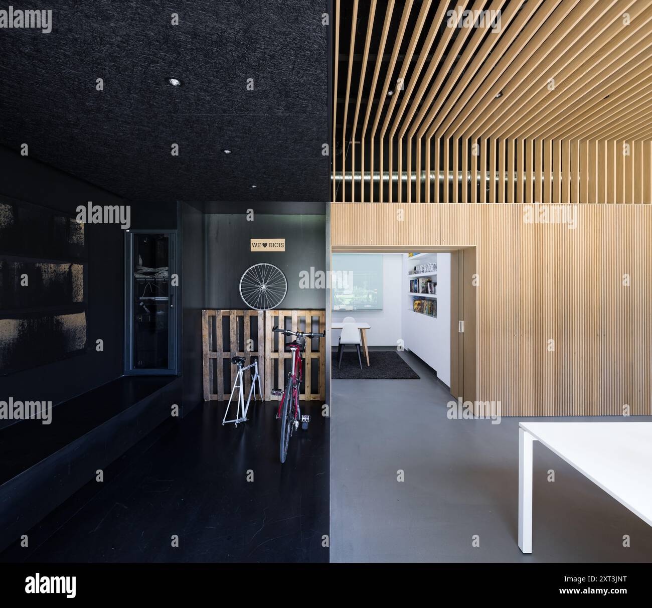 This image showcases a bold contrast in interior design with a dark ...