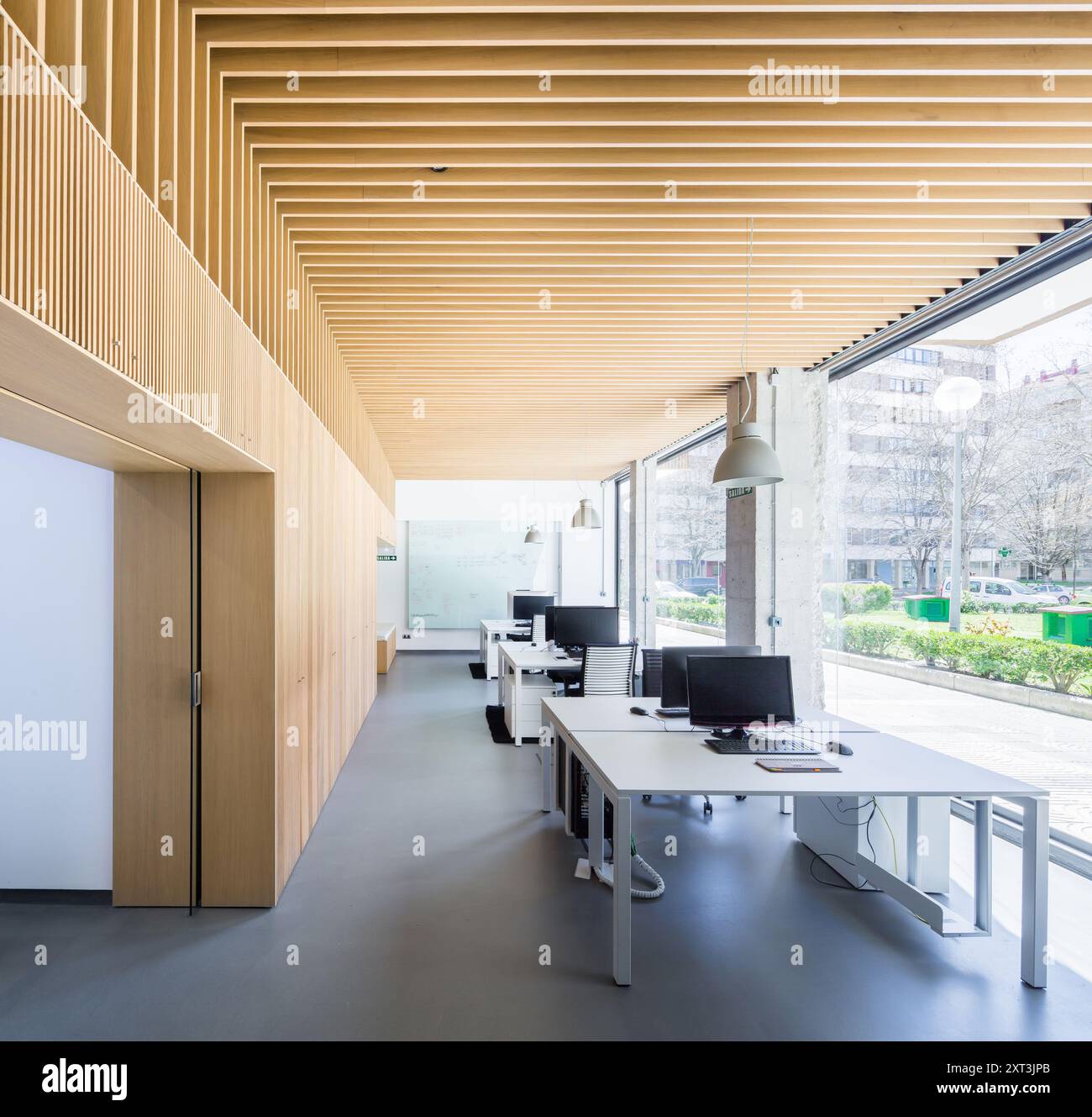 A modern office space that showcases a sleek design with elegant wooden ...